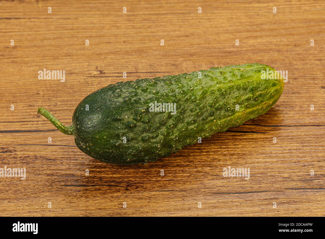Green ripe fresh one cucumber over background Stock Photo - Alamy