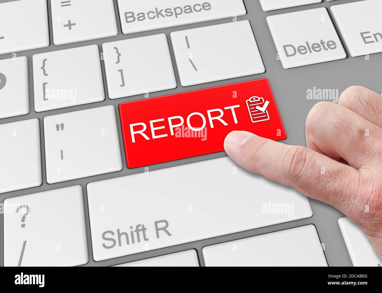 A person clicking a special "report" button on a laptop keyboard Stock ...