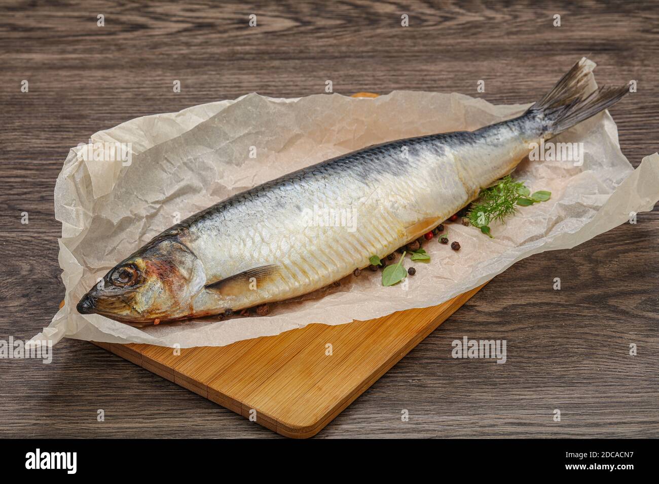 Salted Herring fish with pepper and spices Stock Photo - Alamy