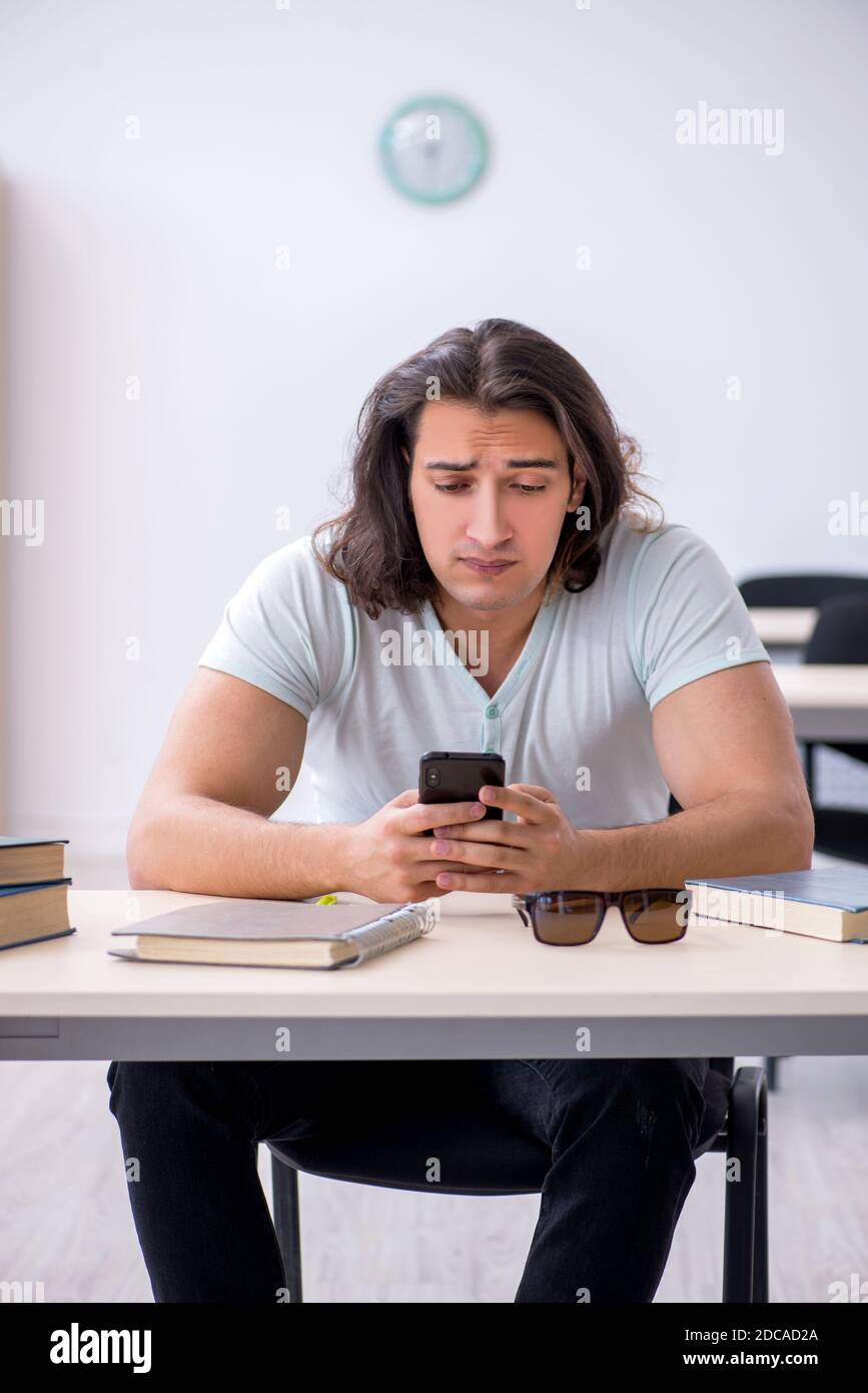 Young student preparing for exam in the classroom Stock Photo - Alamy
