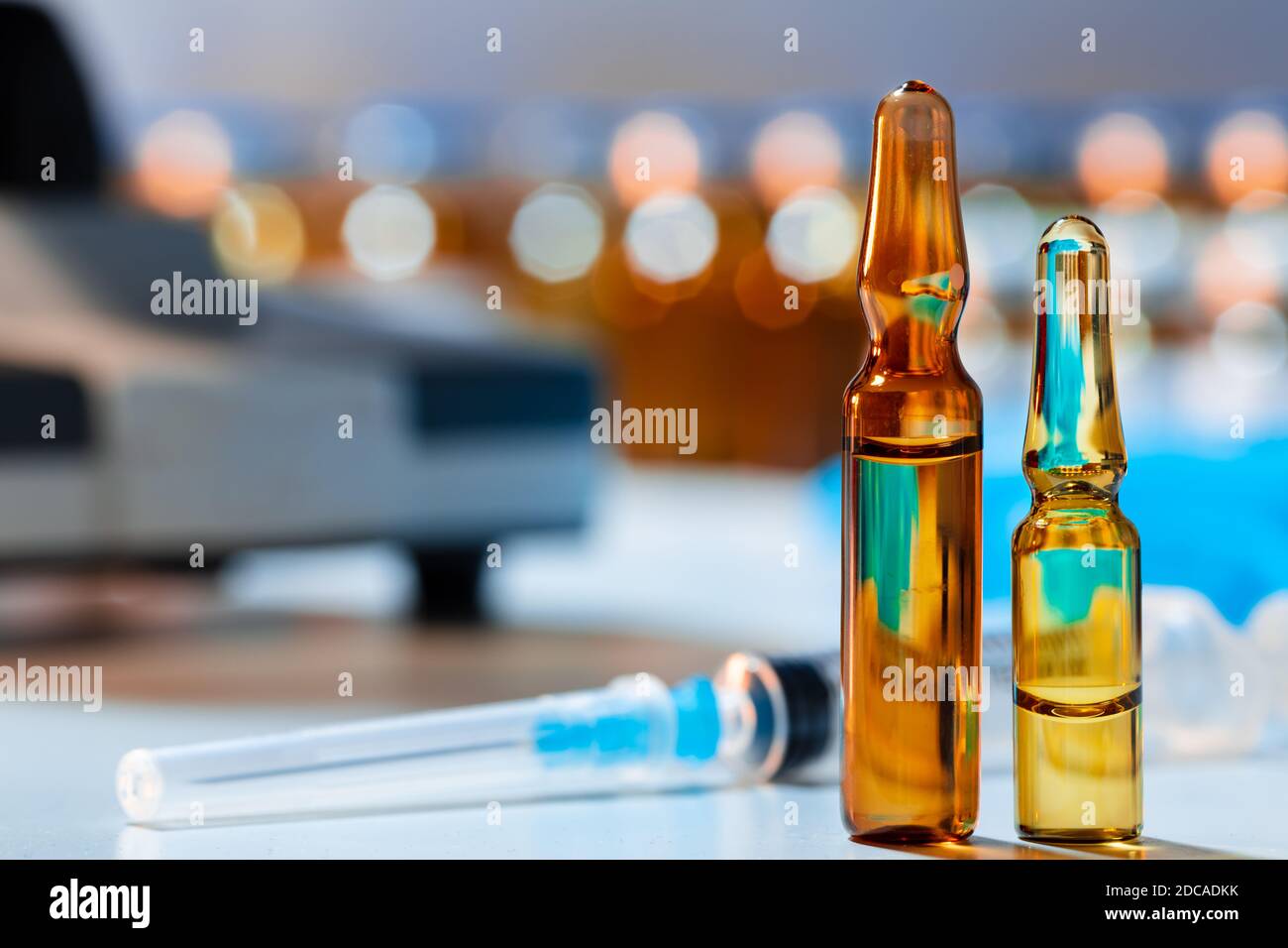 Medical vial with medication near microscope photo Stock Photo - Alamy