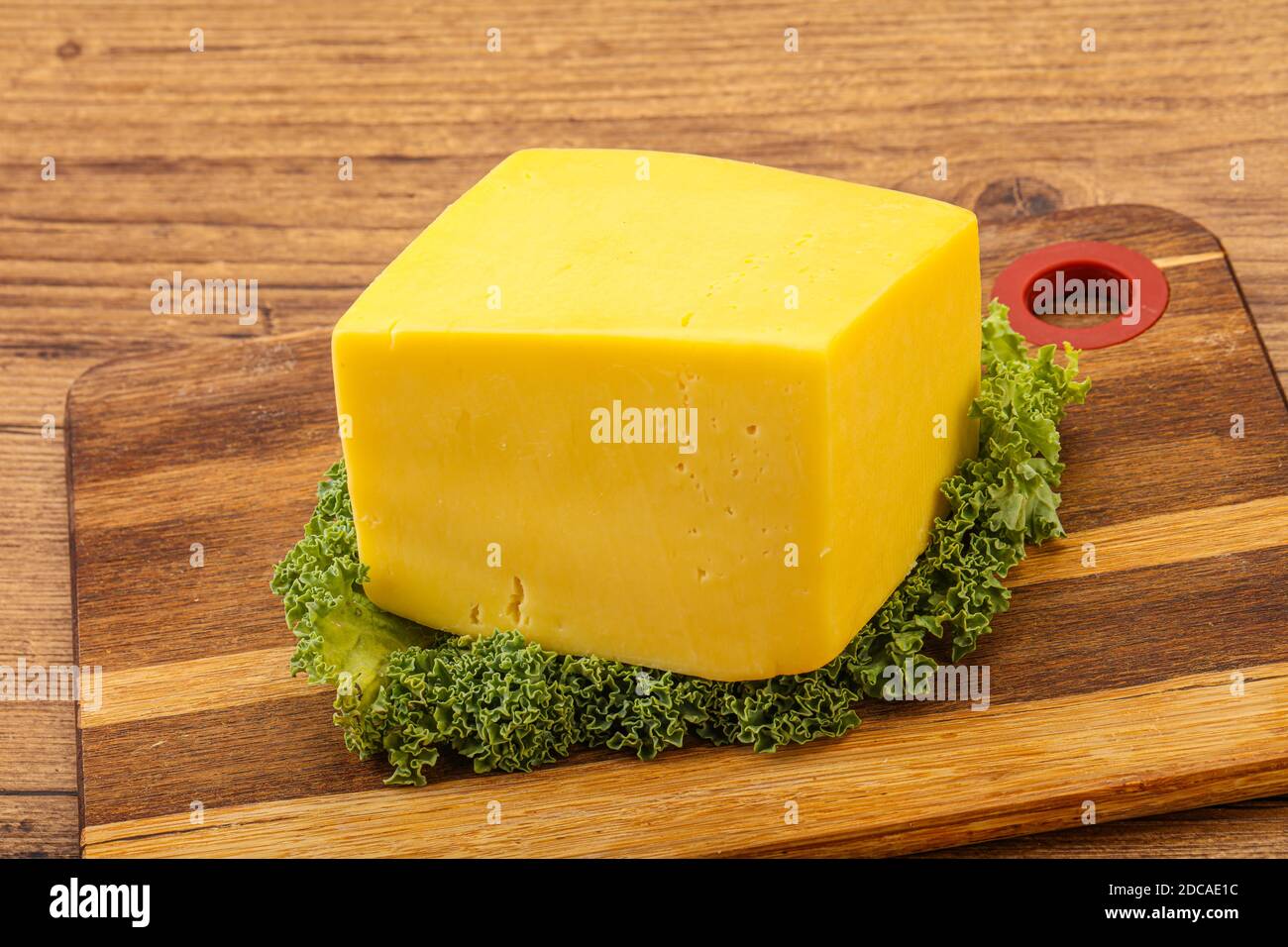 Yellow tilsiter cheese dairy product brick Stock Photo - Alamy