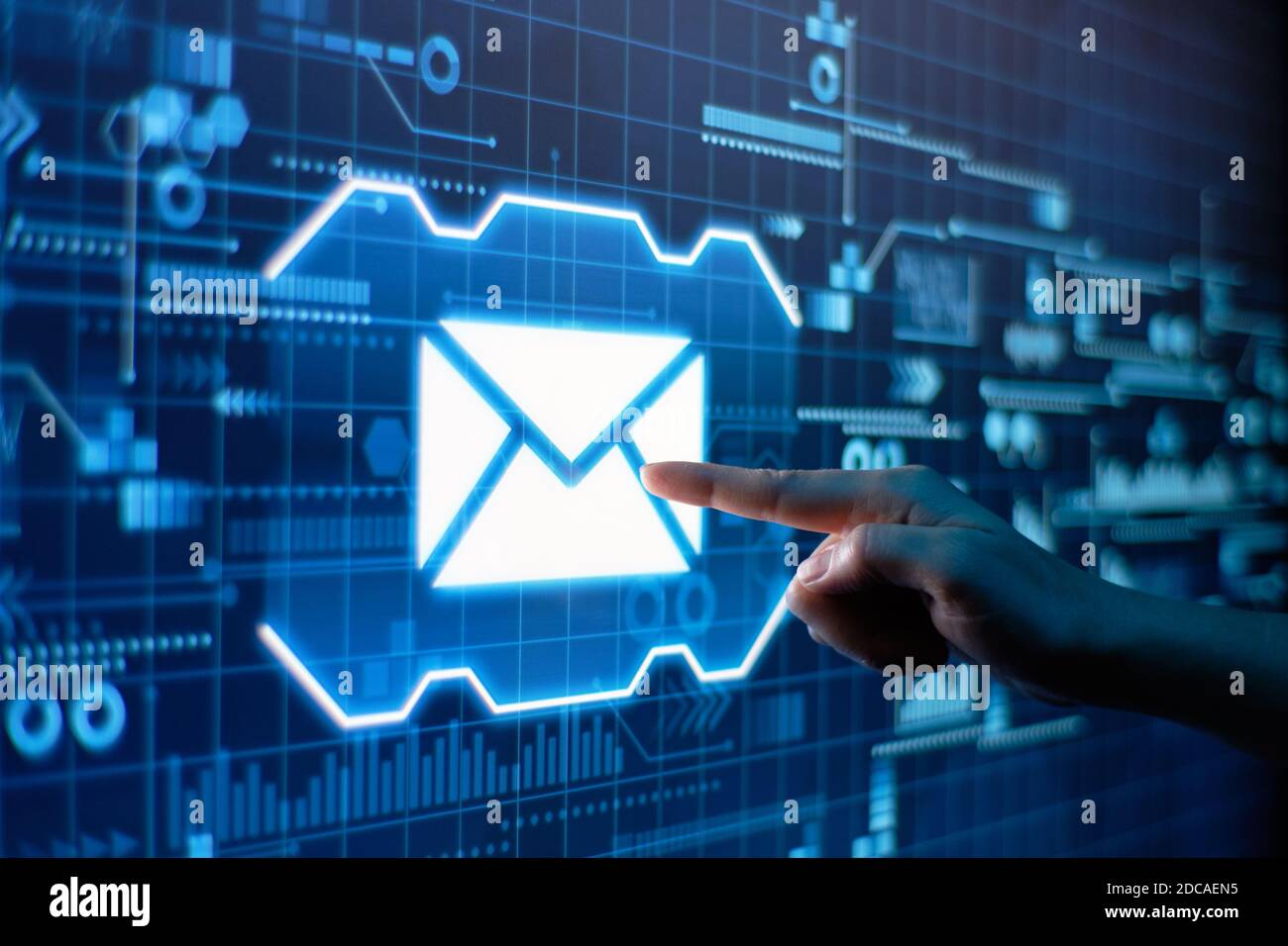 A hand presses email on a futuristic display Stock Photo - Alamy