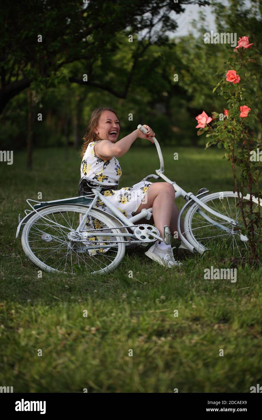 The girl fell off the bike Stock Photo - Alamy