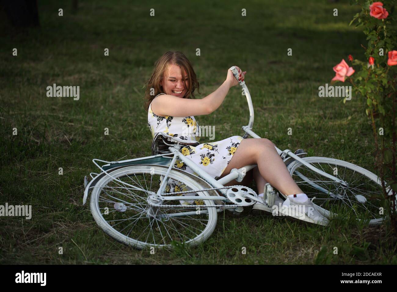 The girl fell off the bike Stock Photo - Alamy