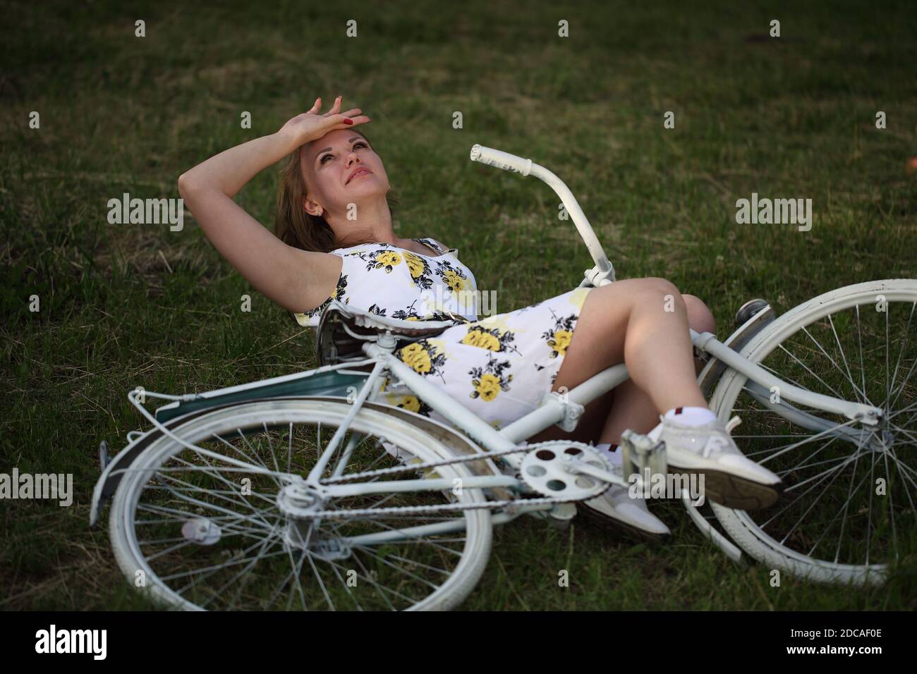 The girl fell off the bike Stock Photo - Alamy