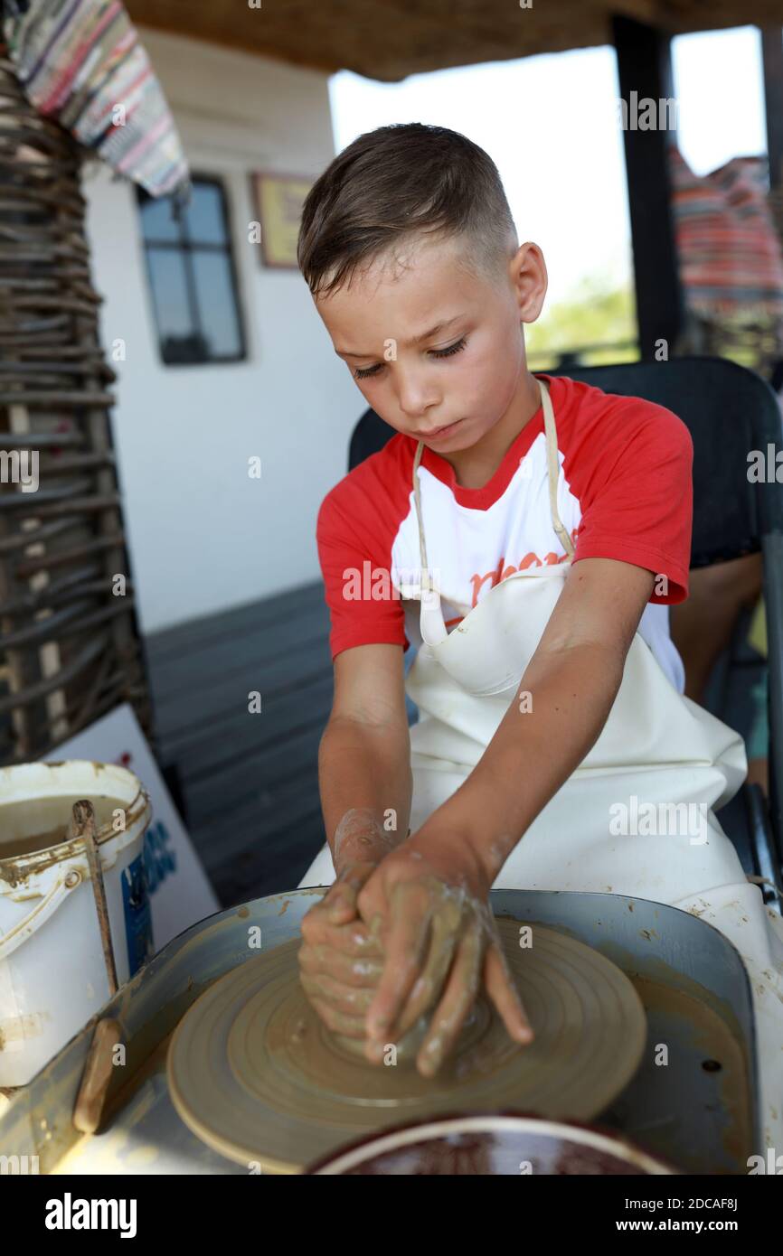 Boy making ceramic work hi-res stock photography and images - Alamy