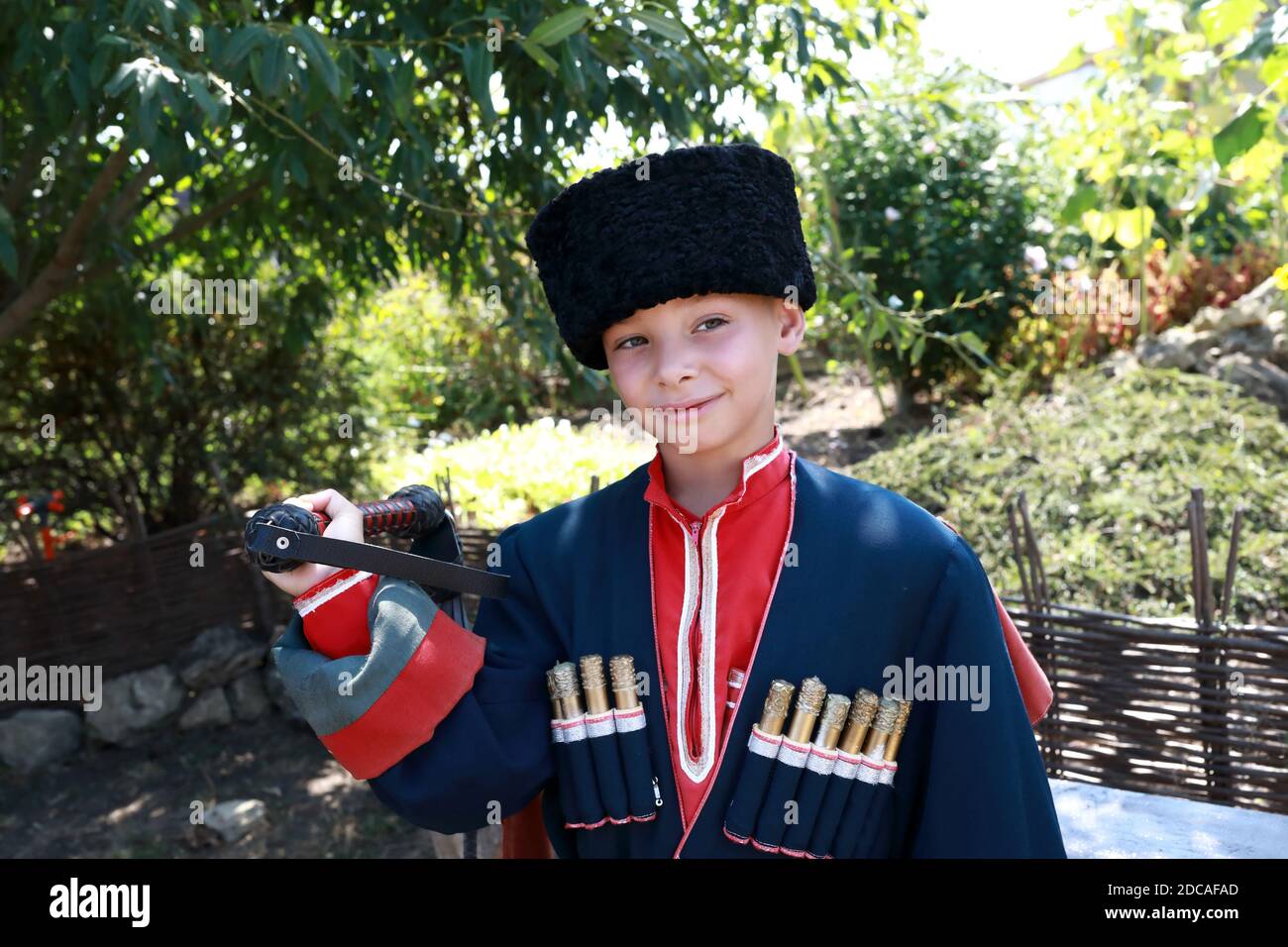 Portrait of boy in traditional Cossack clothes Stock Photo - Alamy