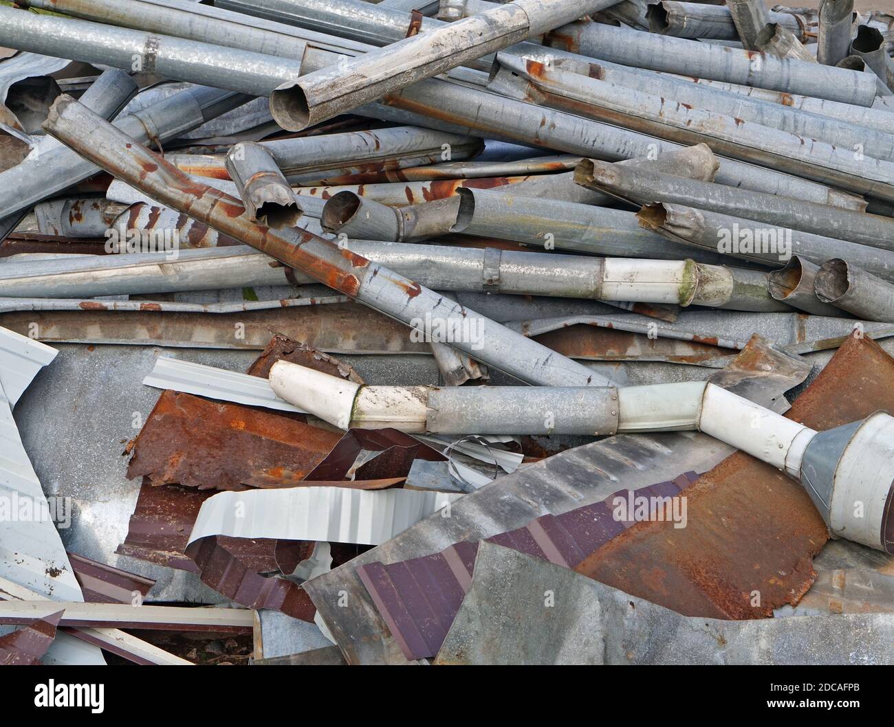 The old galvanized rain drain rusty pipes background Stock Photo - Alamy