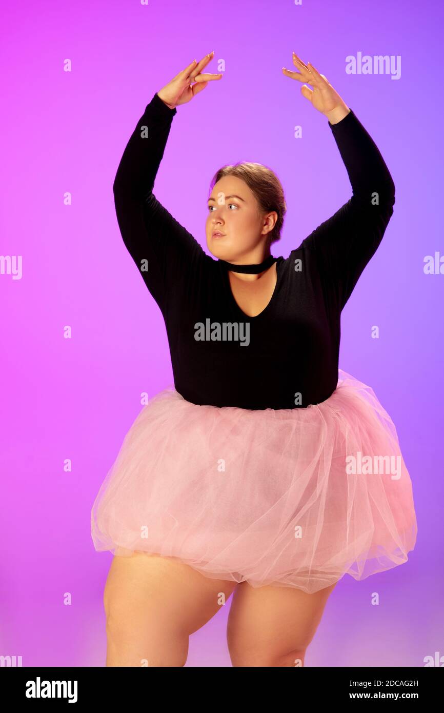 Aspiration. Beautiful caucasian plus size model practicing ballet dance ...