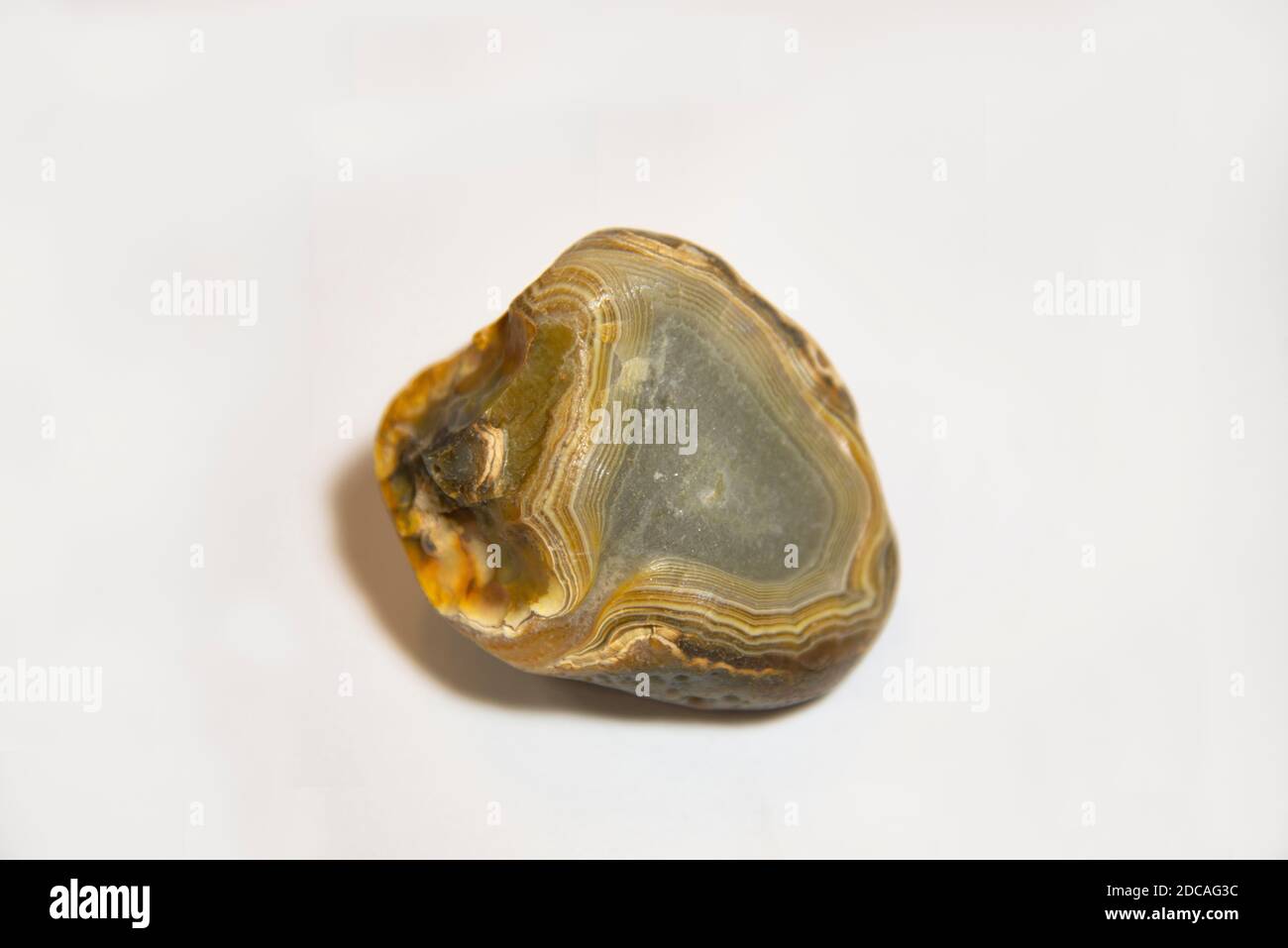 Wild agate stone in warm colors on a white background Stock Photo - Alamy