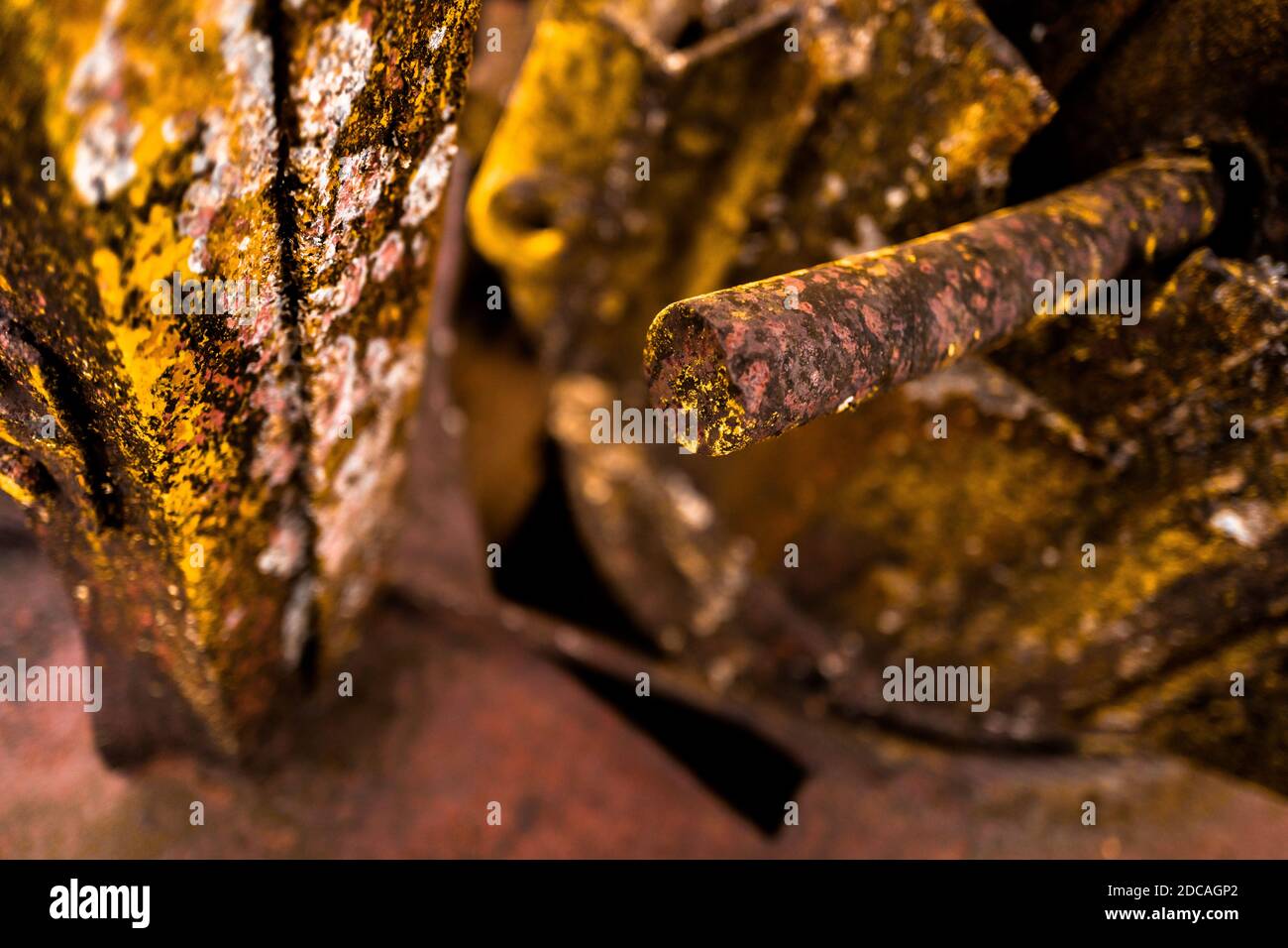 A corroded working mechanism is seen on the deck of an old gold dredge ...