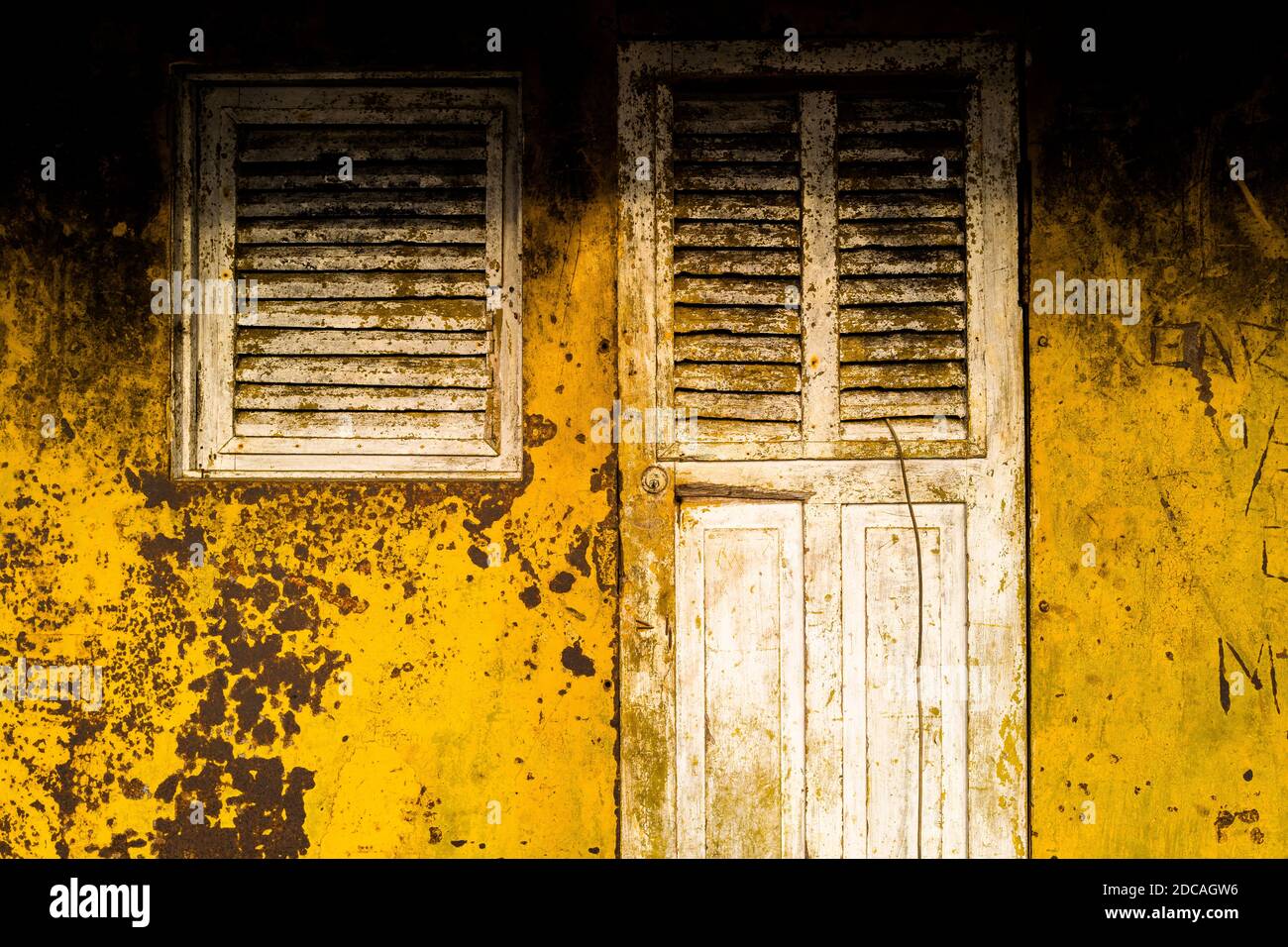 A rotten window next to a rotten cabin’s door are seen on the deck of ...
