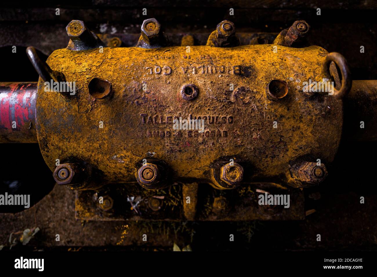 A corroded engine component is seen in the lower deck of an old gold ...