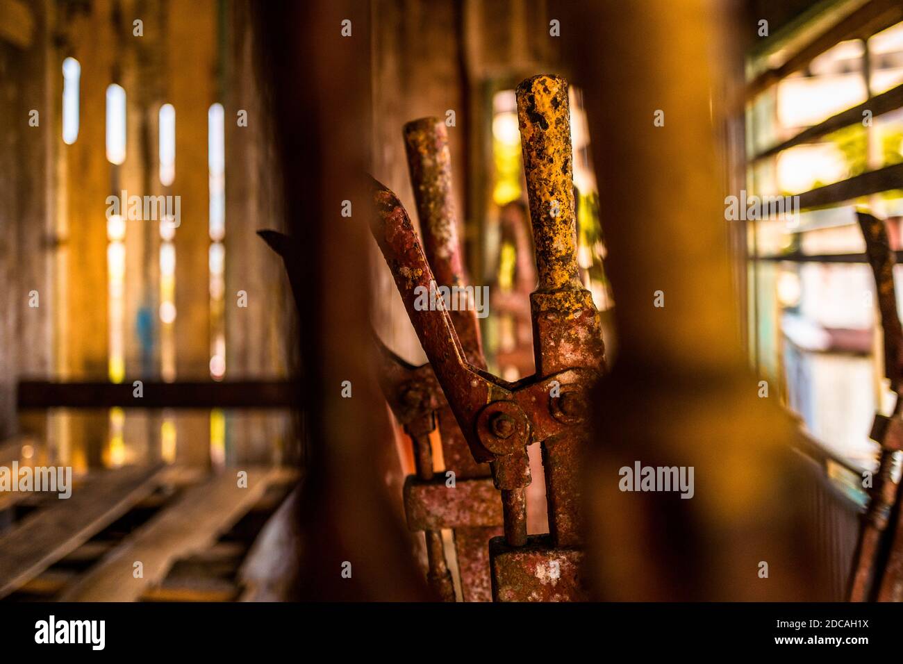 Corroded hand levers are seen inside a control room of an old gold ...