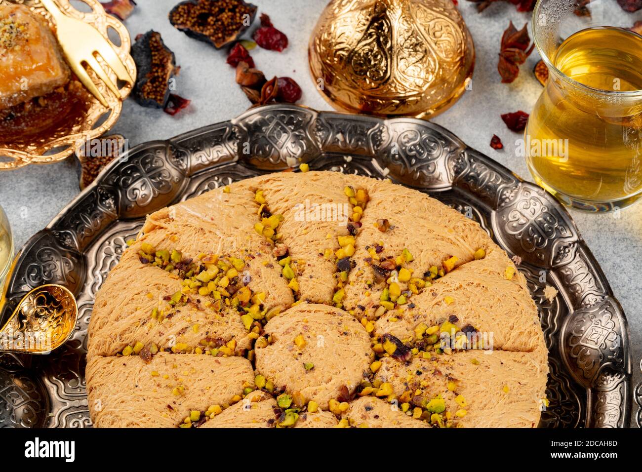 Turkish pastries and scattered dry fruits on table Stock Photo - Alamy