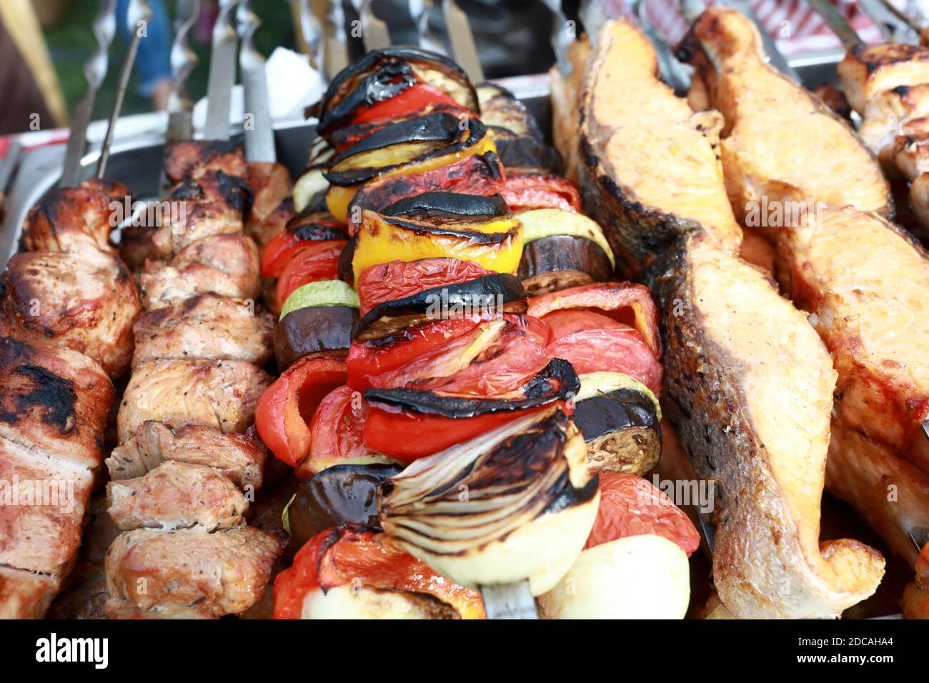 Vegetable and meat kebabs on skewers on market counter Stock Photo - Alamy