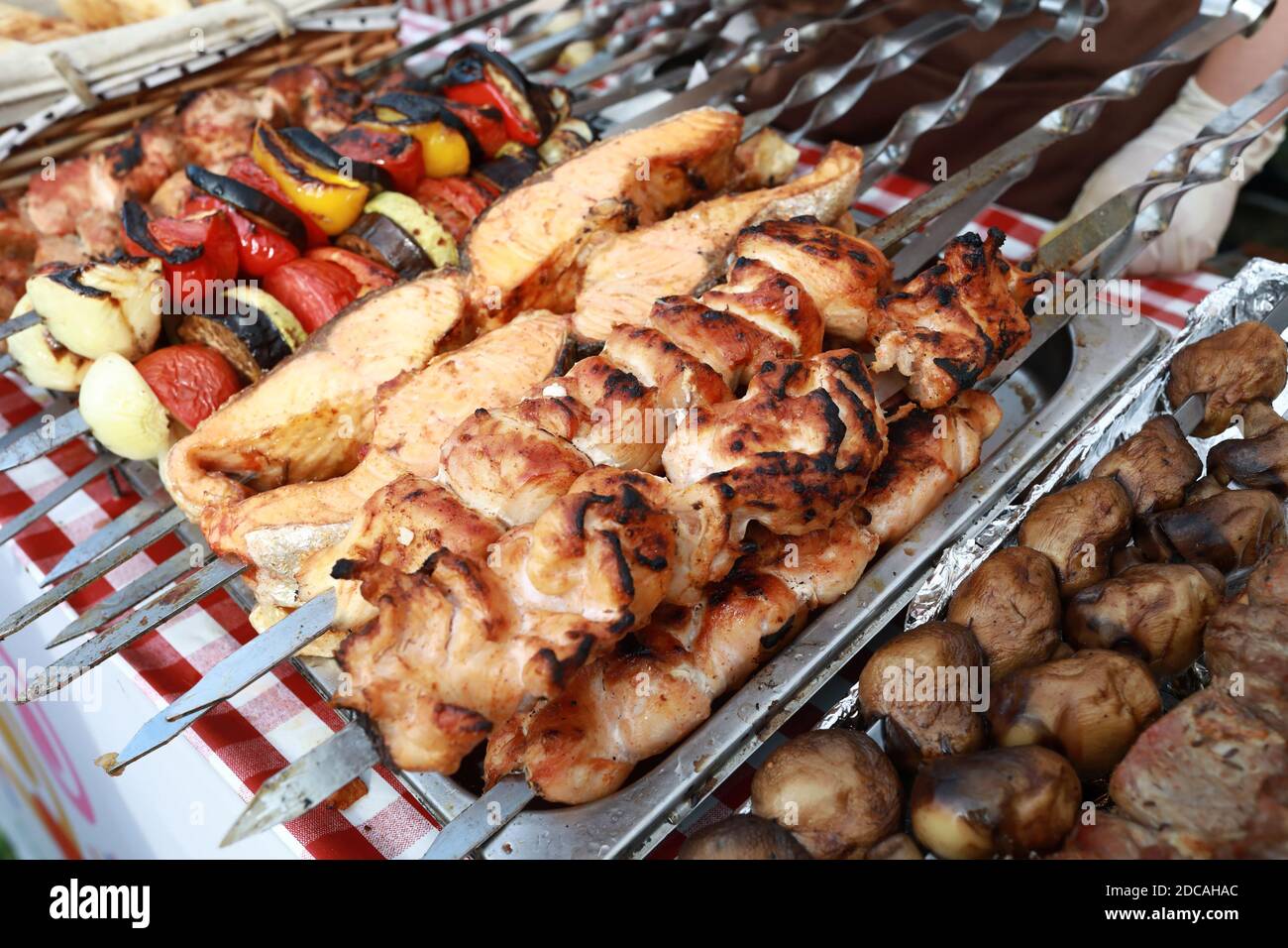 Meat and vegetable kebabs on skewers on market counter Stock Photo - Alamy