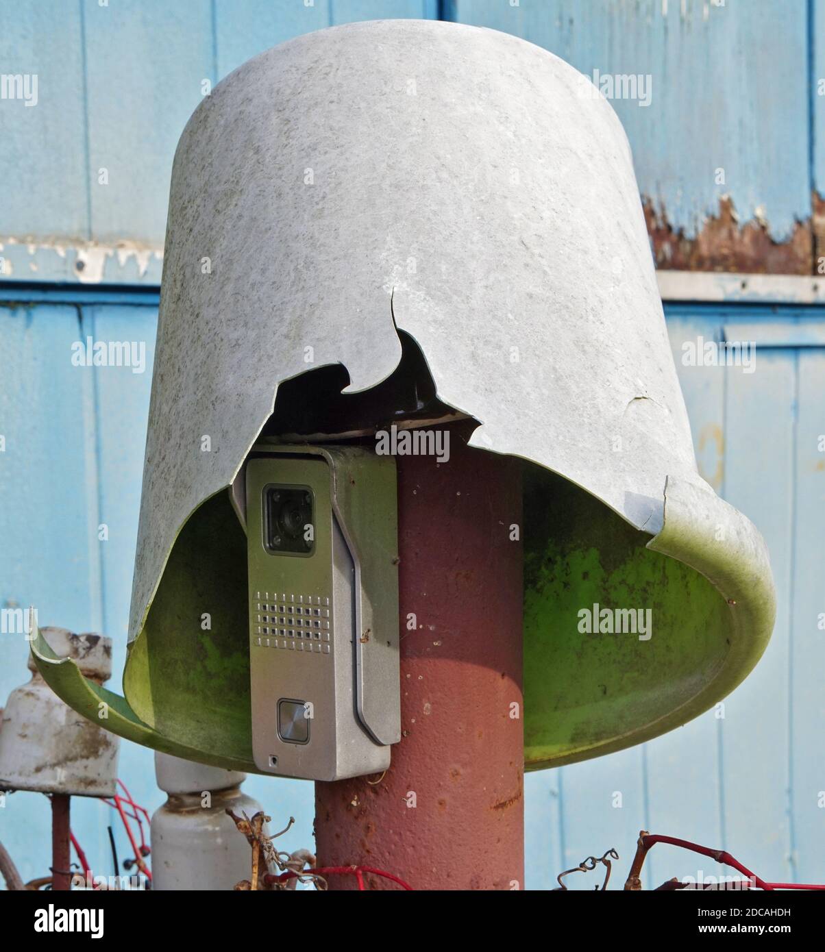 The intercom was covered with a bucket to protect it from the weather ...