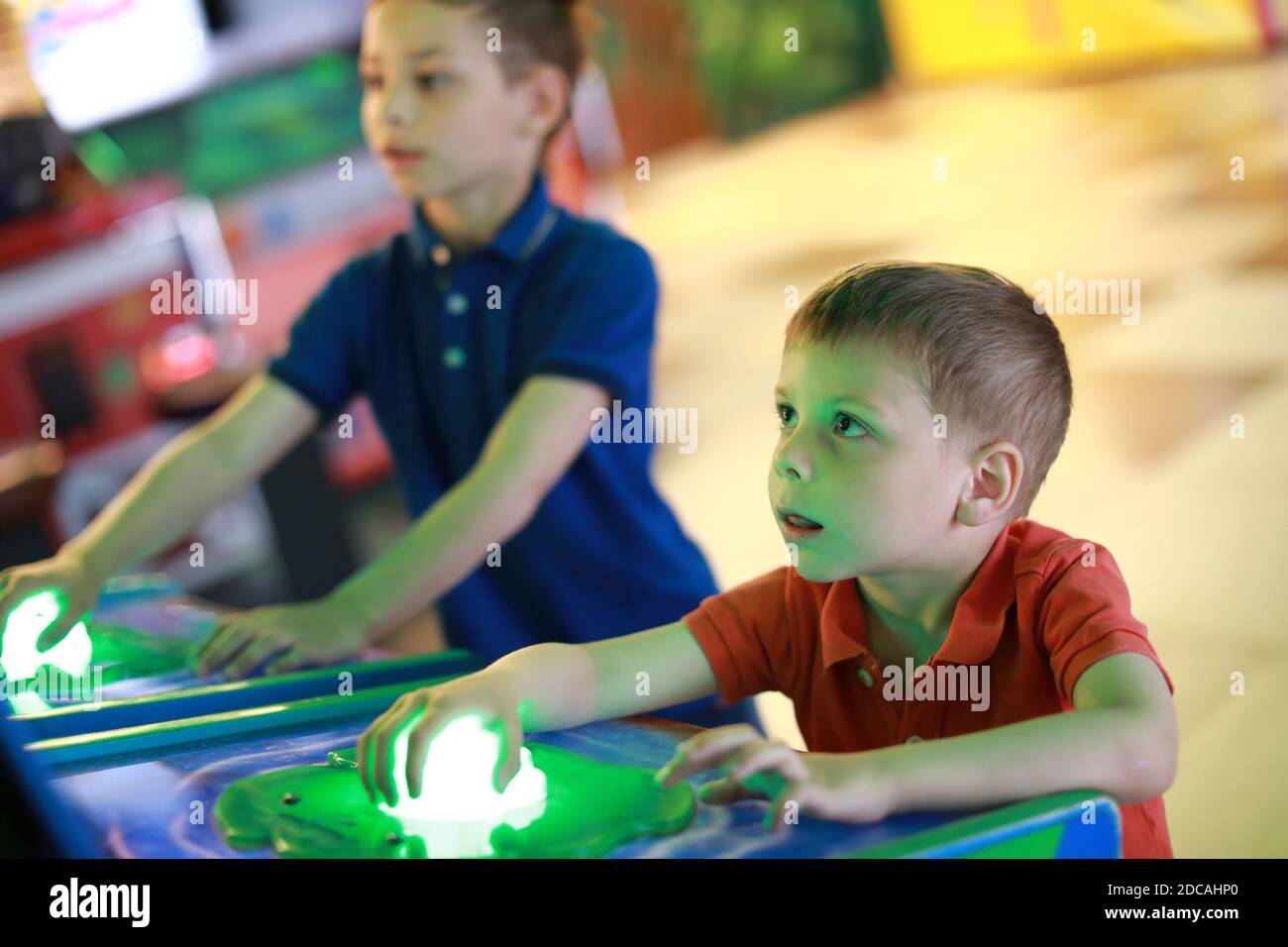 Two boys playing with game console hi-res stock photography and images ...
