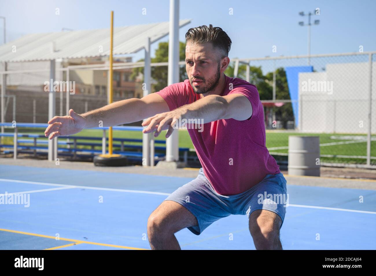 Squatting male model hi-res stock photography and images - Alamy