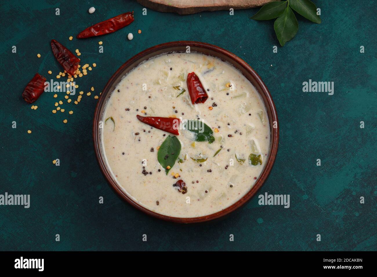 Topview of a wooden bowl full of raitha or pachadi, south Indian side ...