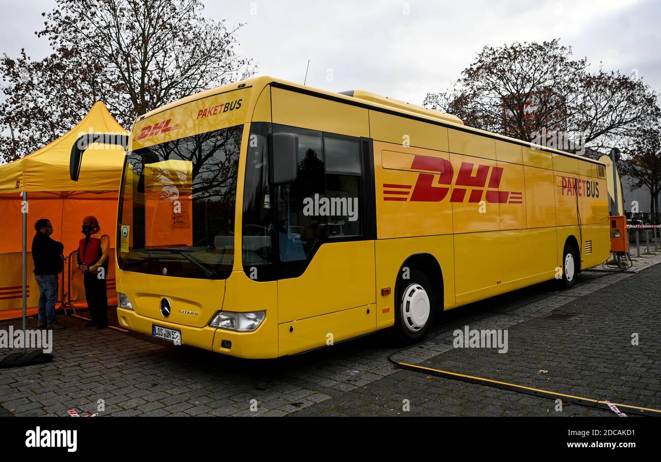 Berlin, Germany. 18th Nov, 2020. A DHL bus is parked in a parking lot ...