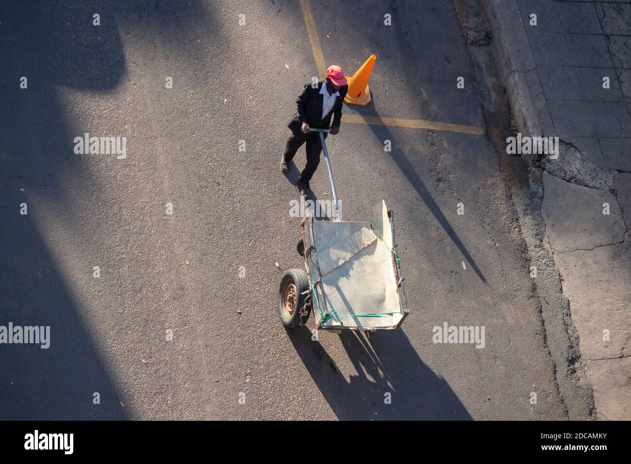 Worker pushing cart down hi-res stock photography and images - Alamy