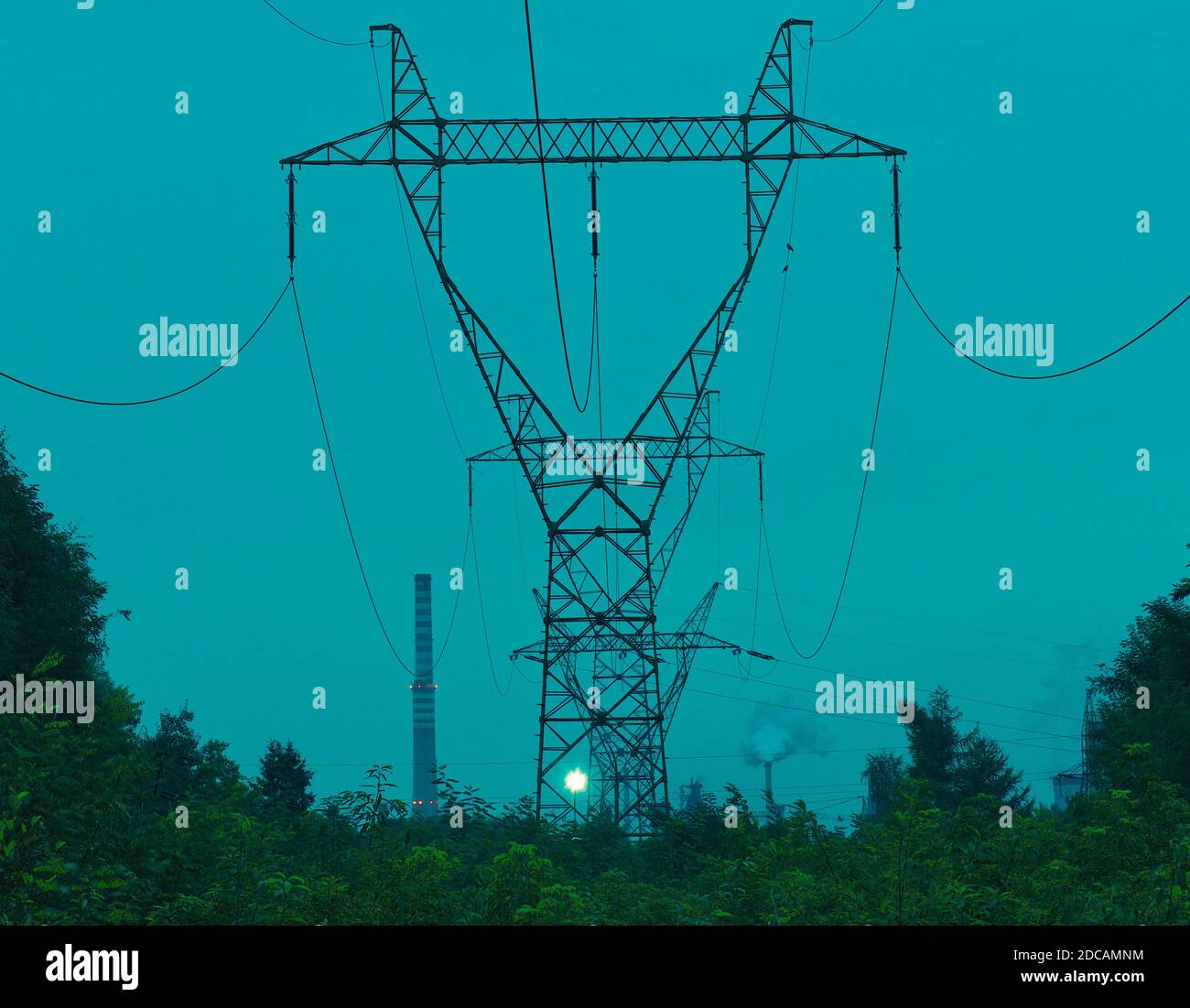 Electricity pylons and power lines at night Stock Photo - Alamy