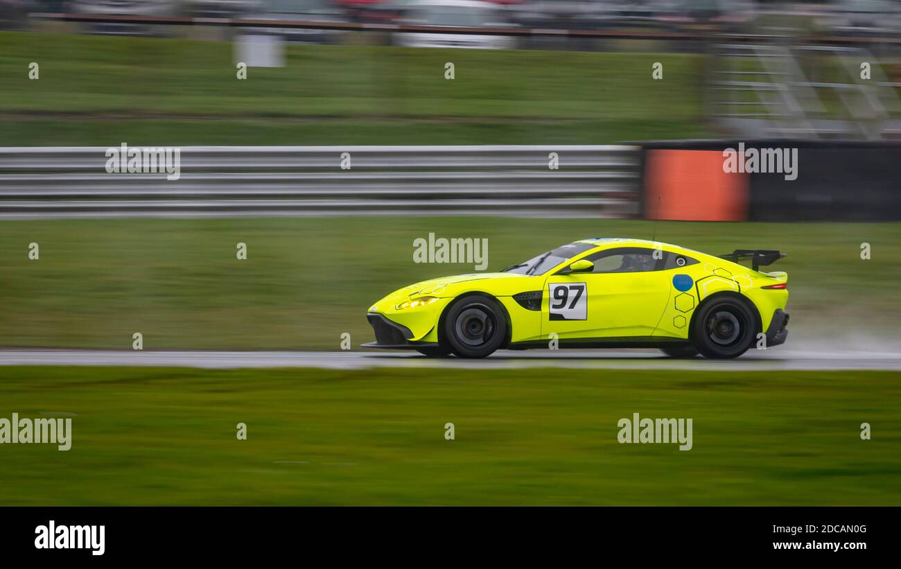 A panning shot of a racing car as it circuits a track Stock Photo - Alamy