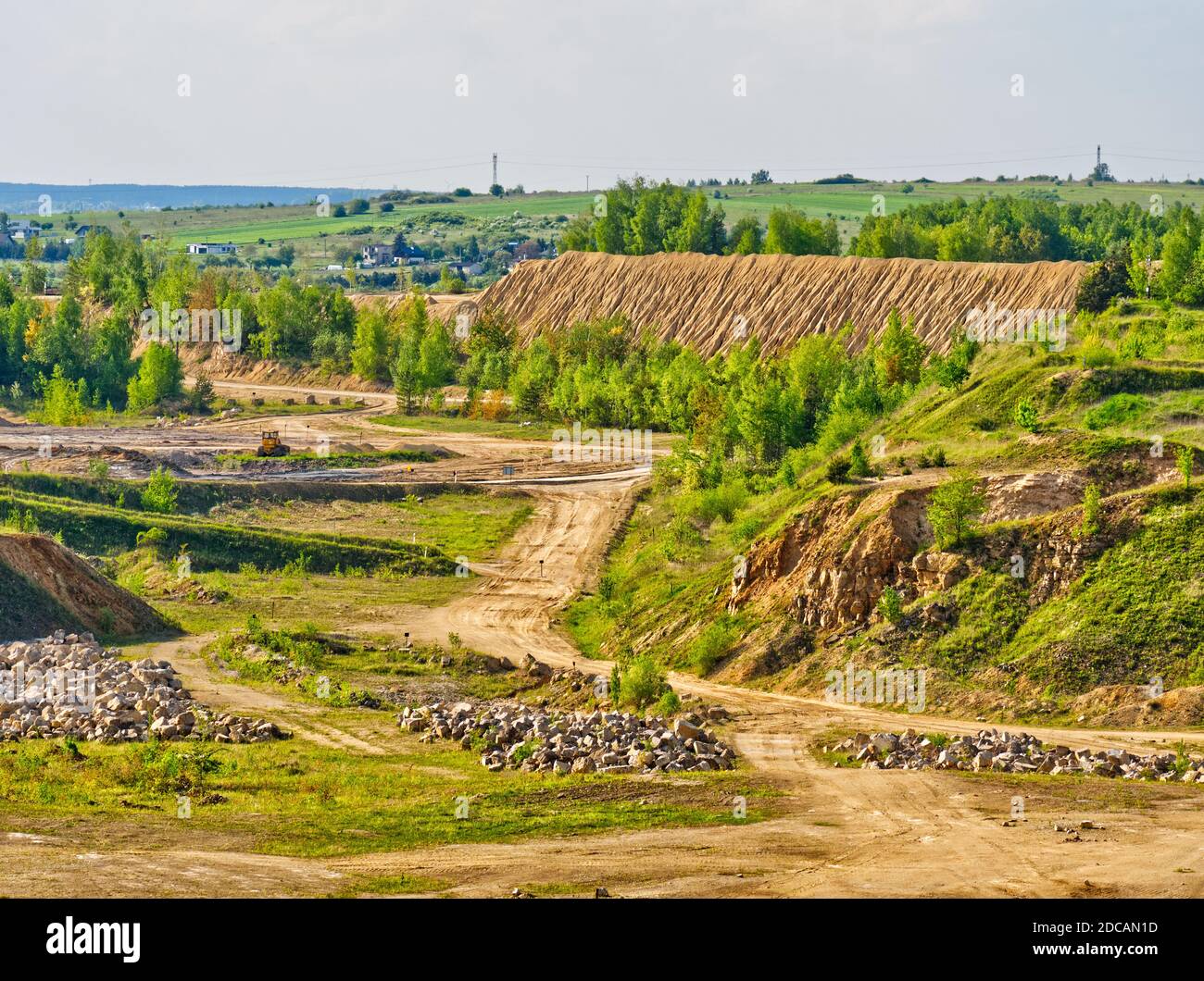 A quarry and excavators equipment in landscapes Stock Photo - Alamy