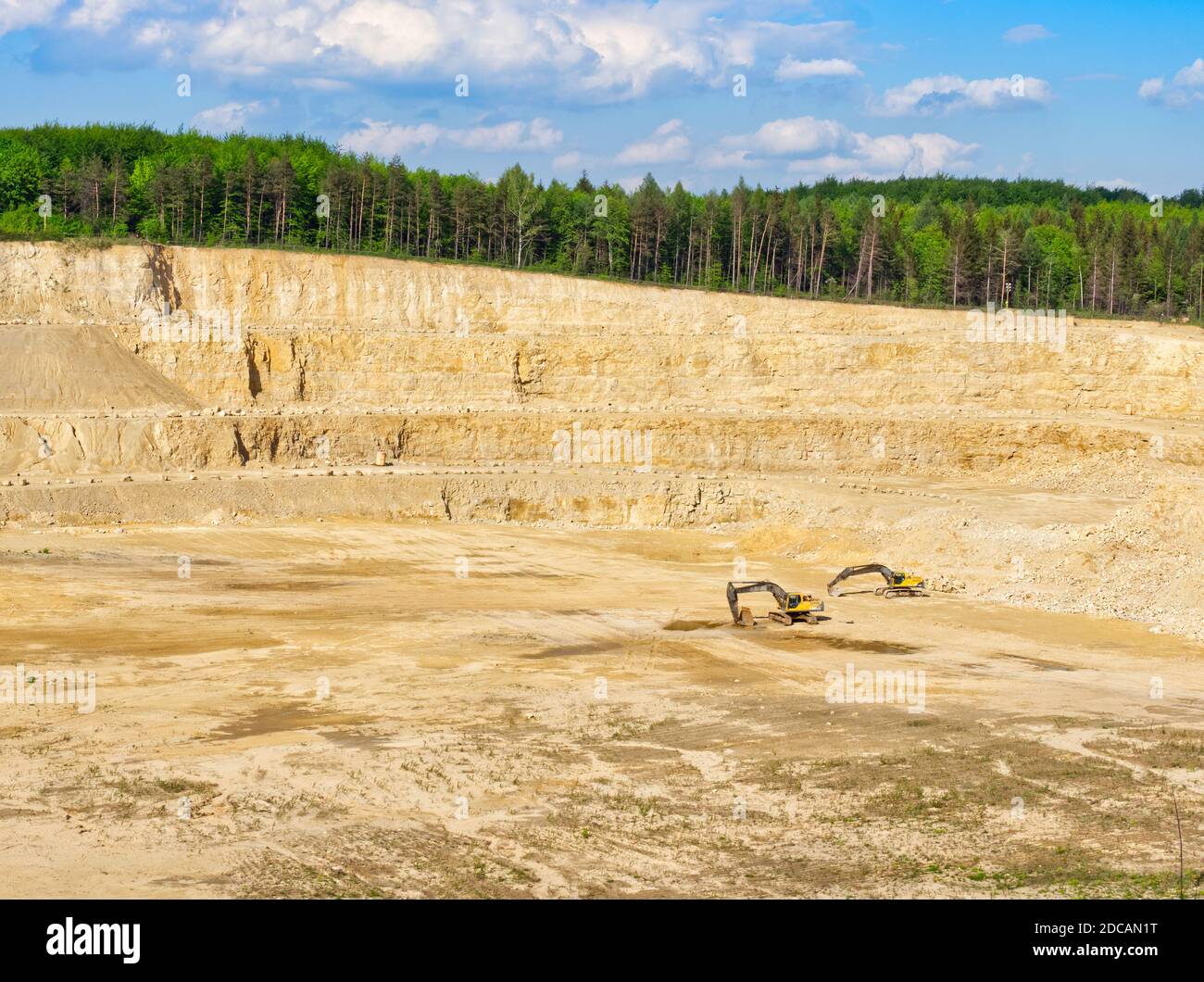 A quarry and excavators equipment in landscapes Stock Photo - Alamy