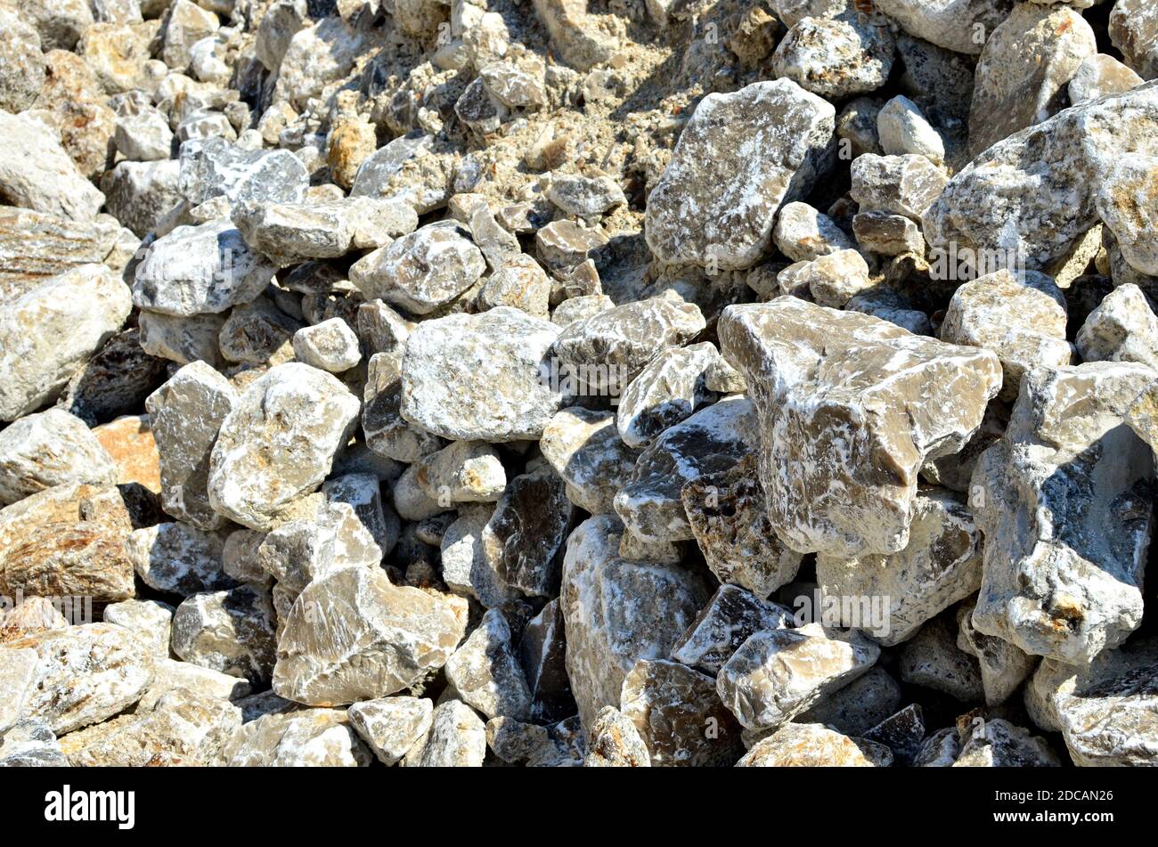 Natural gray gypsum stone. Close up image of stones with black and ...