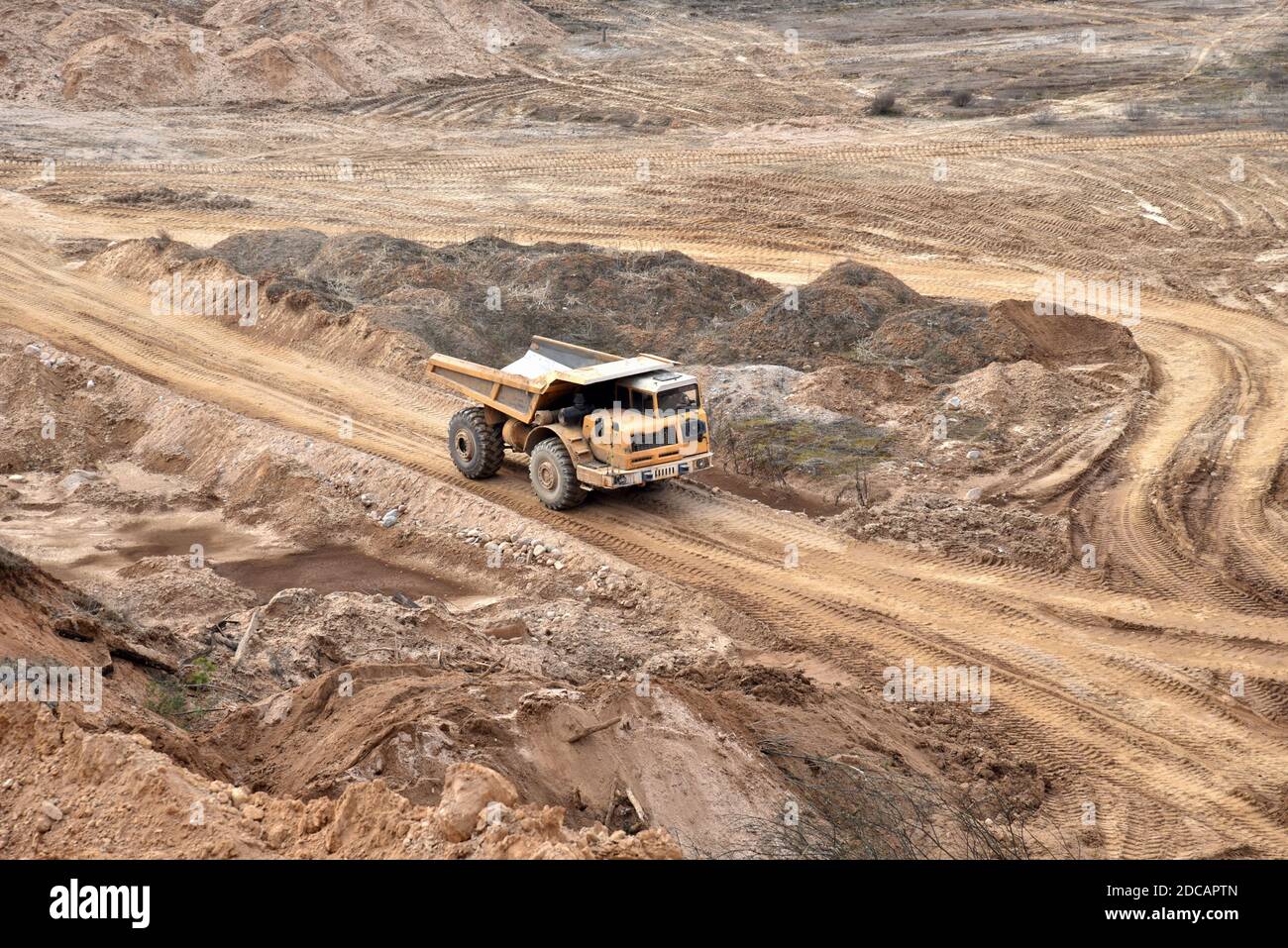 Mining truck transportion minerals and sand in the open-pit. Heavy ...