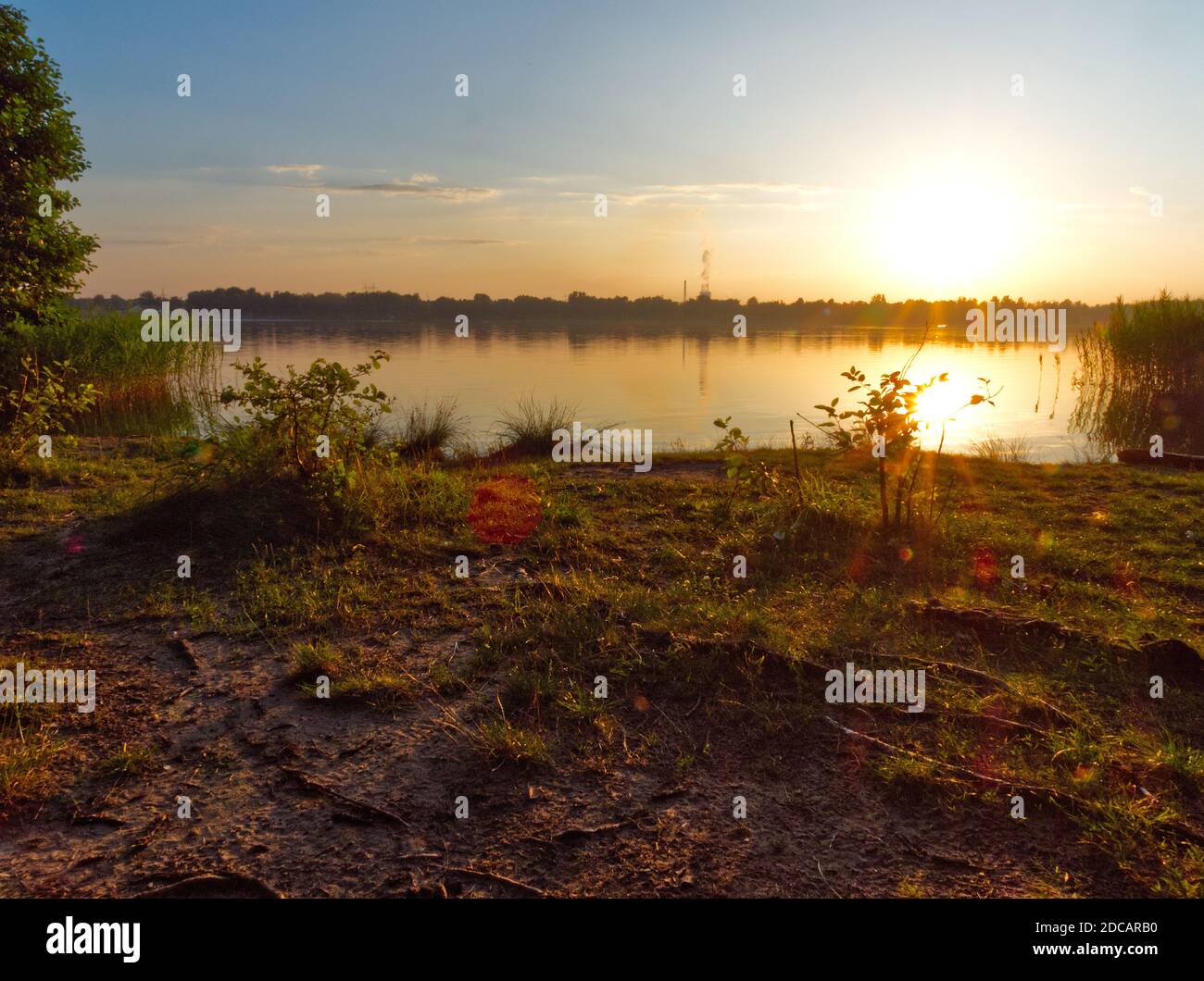 Setting sun in nature environment. Photo with a greatly exposed optical ...