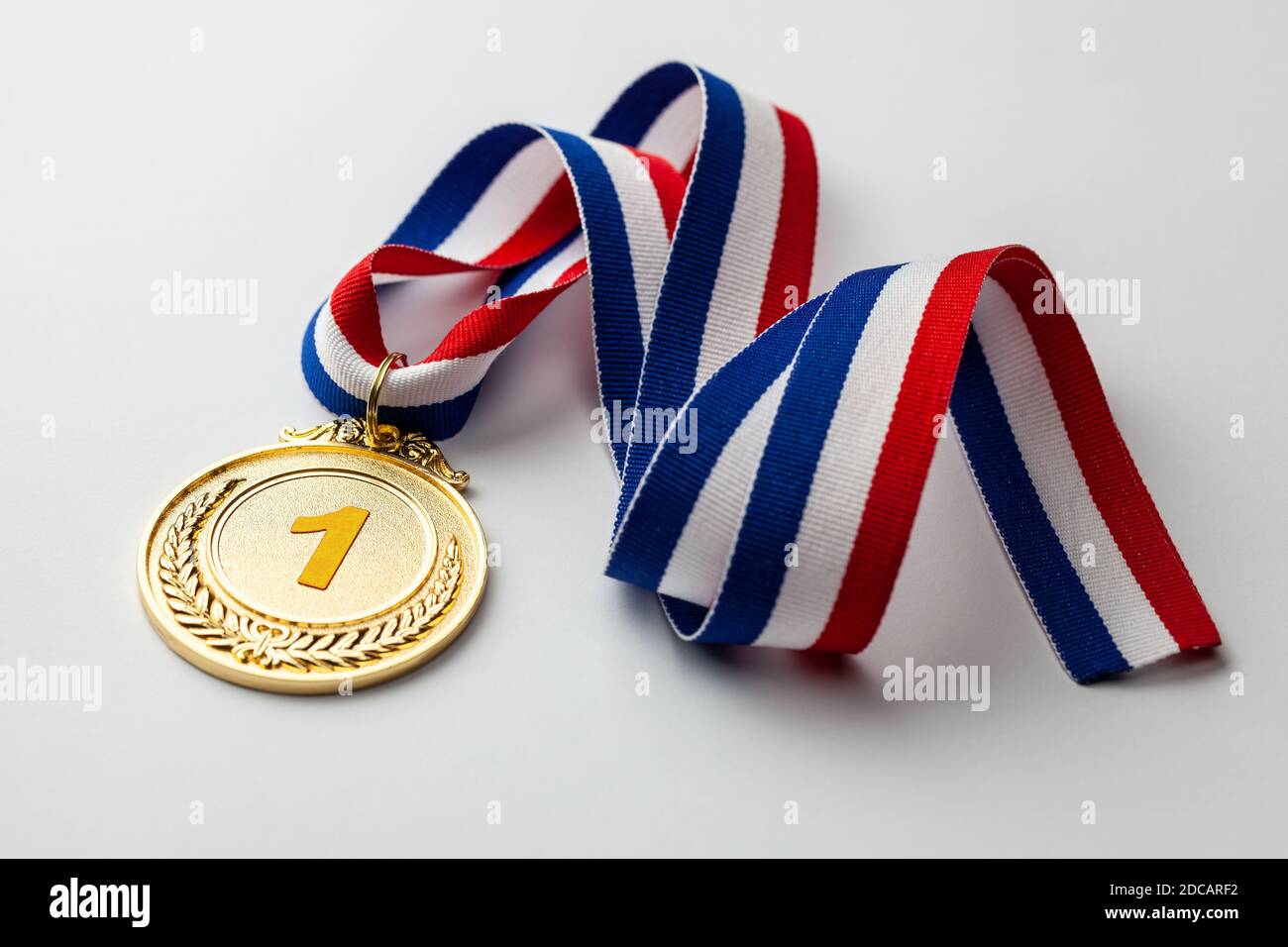 Gold medal. First place award with ribbon Stock Photo - Alamy