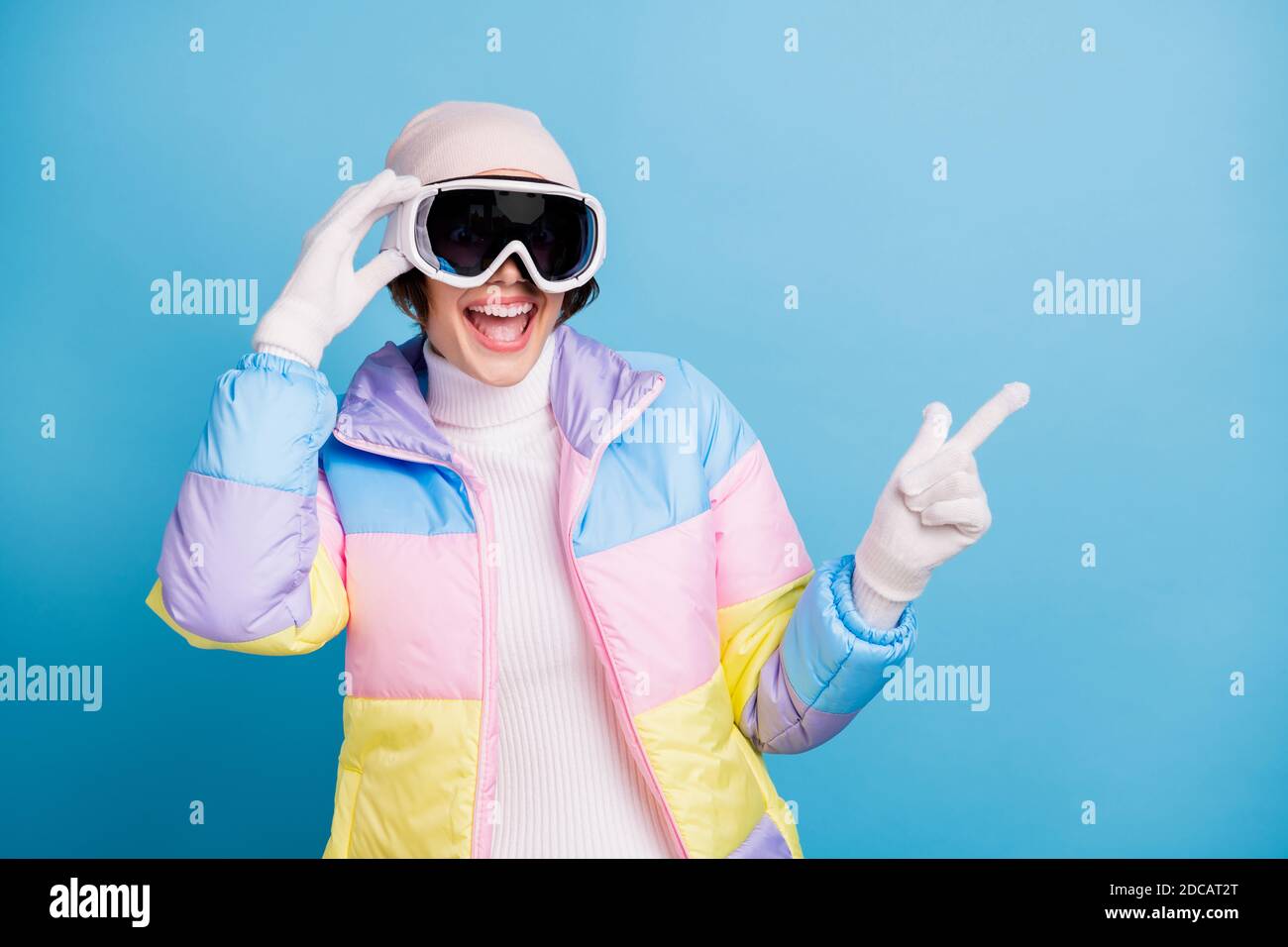 Photo of pretty amazed lady point finger copyspace wear hat white ...