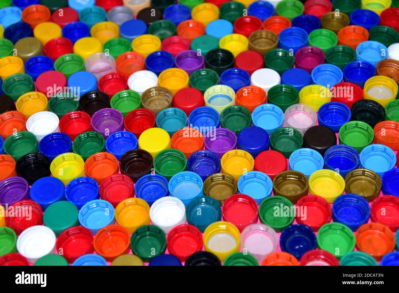 Plastic bottle caps background. Waste cap material is recyclable ...