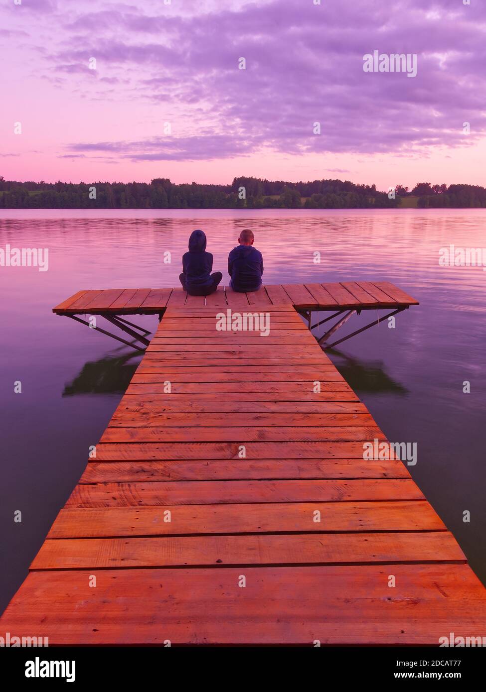 Silhouette people sitting on jetty hi-res stock photography and images ...