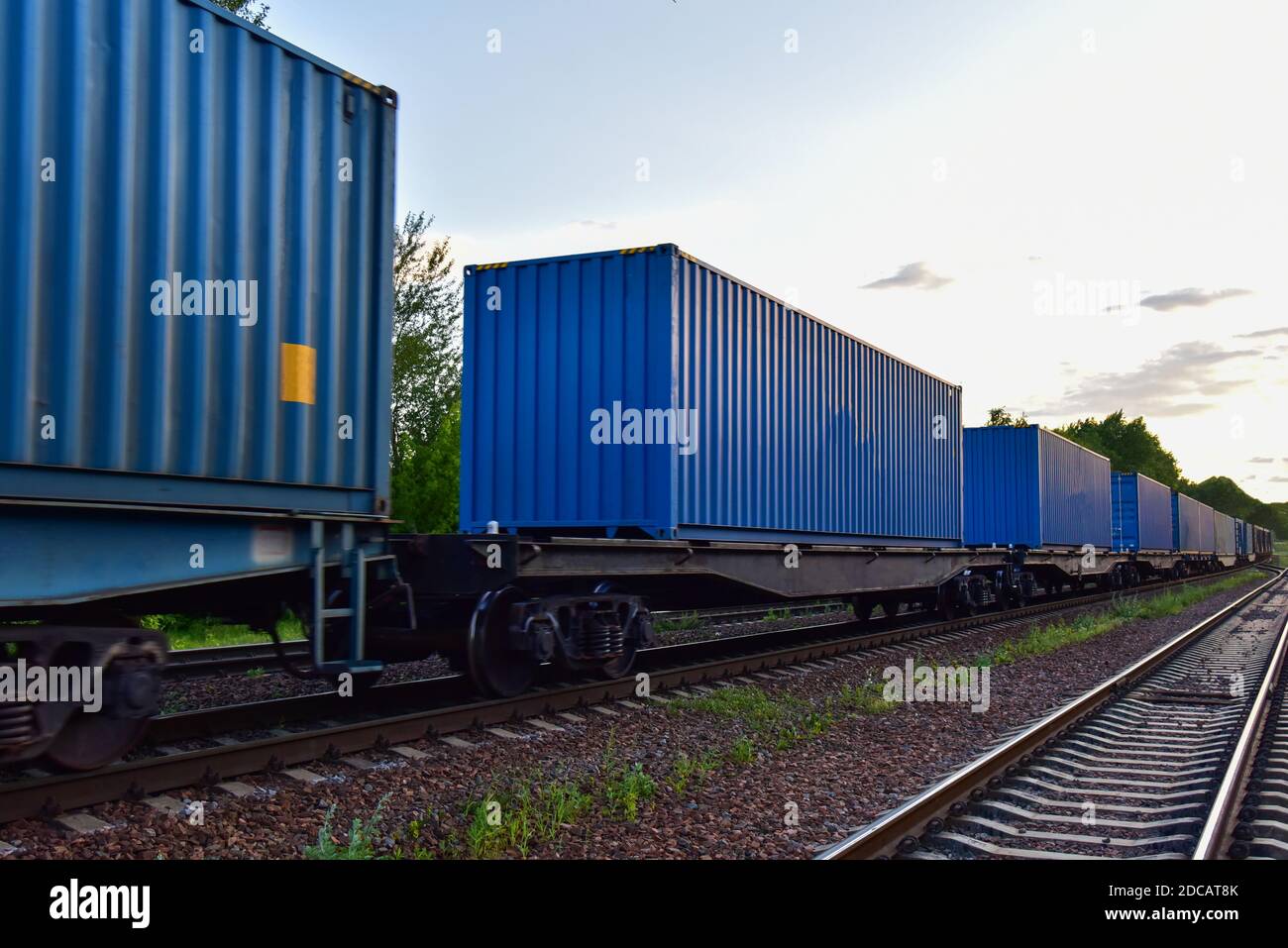 Cargo Containers Transportation On Freight Train By Railway. Intermodal Container On Train Car ...