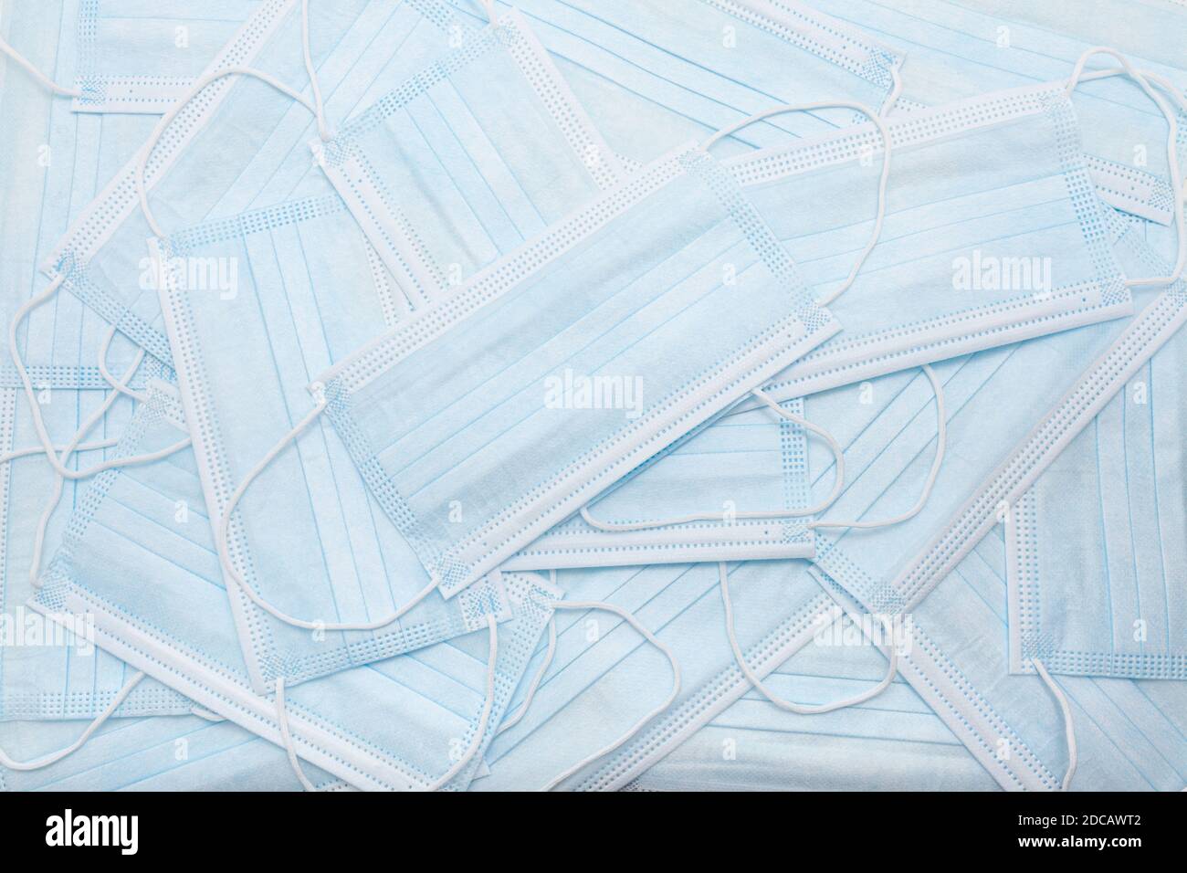 Big pile of light blue medical face masks, top view Stock Photo - Alamy