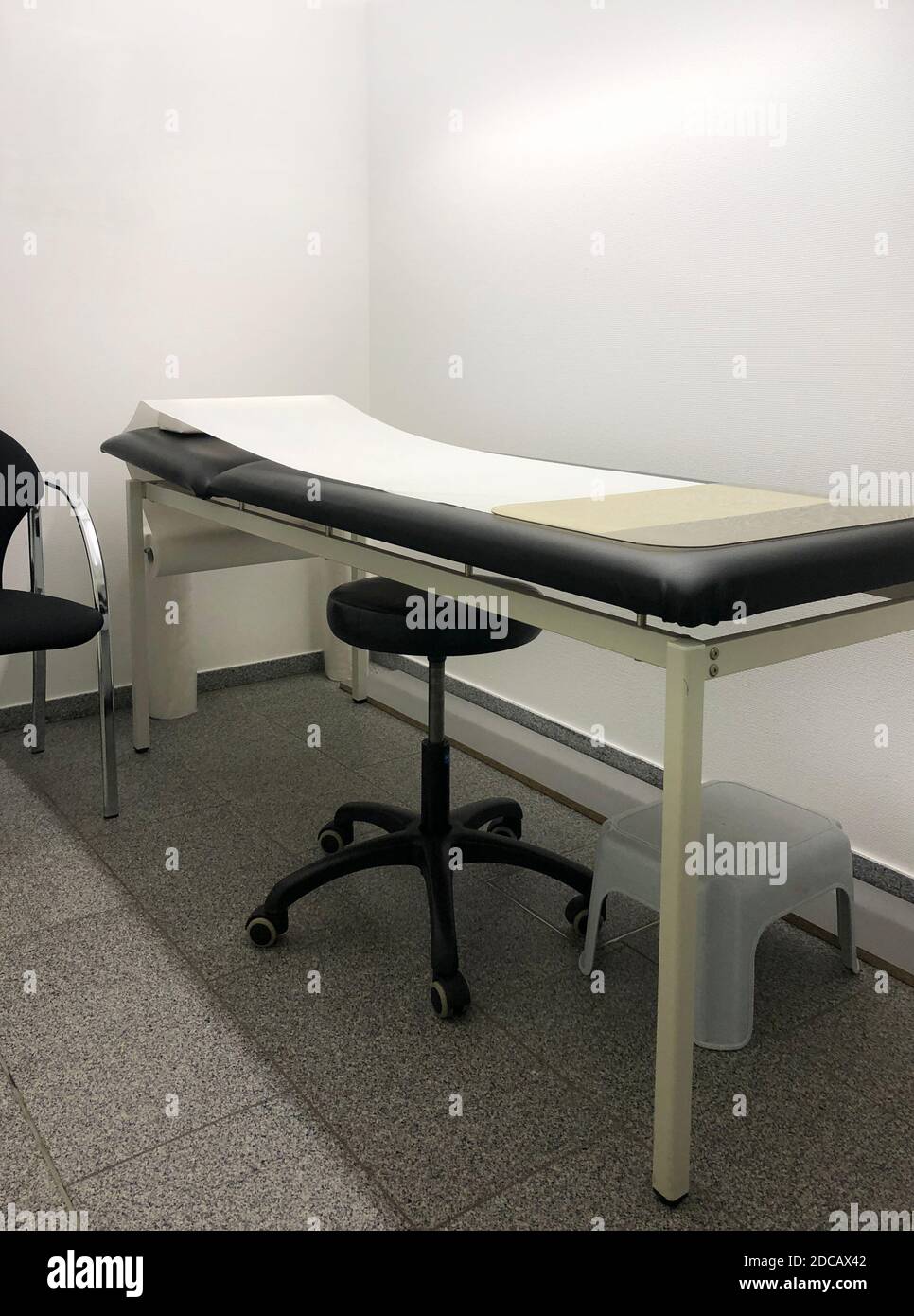 Bench and stool in doctor's office Stock Photo - Alamy