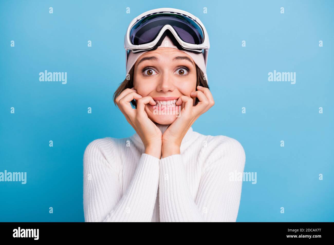 Photo of scared terrified young woman bite nails teeth wear mask ...