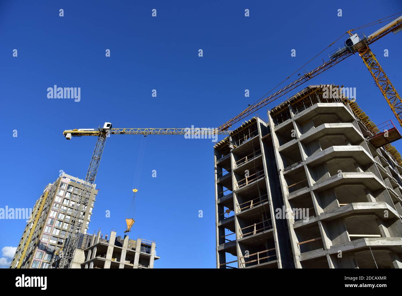 Preparing to pour a bucket of concrete into formwork.Tower crane ...