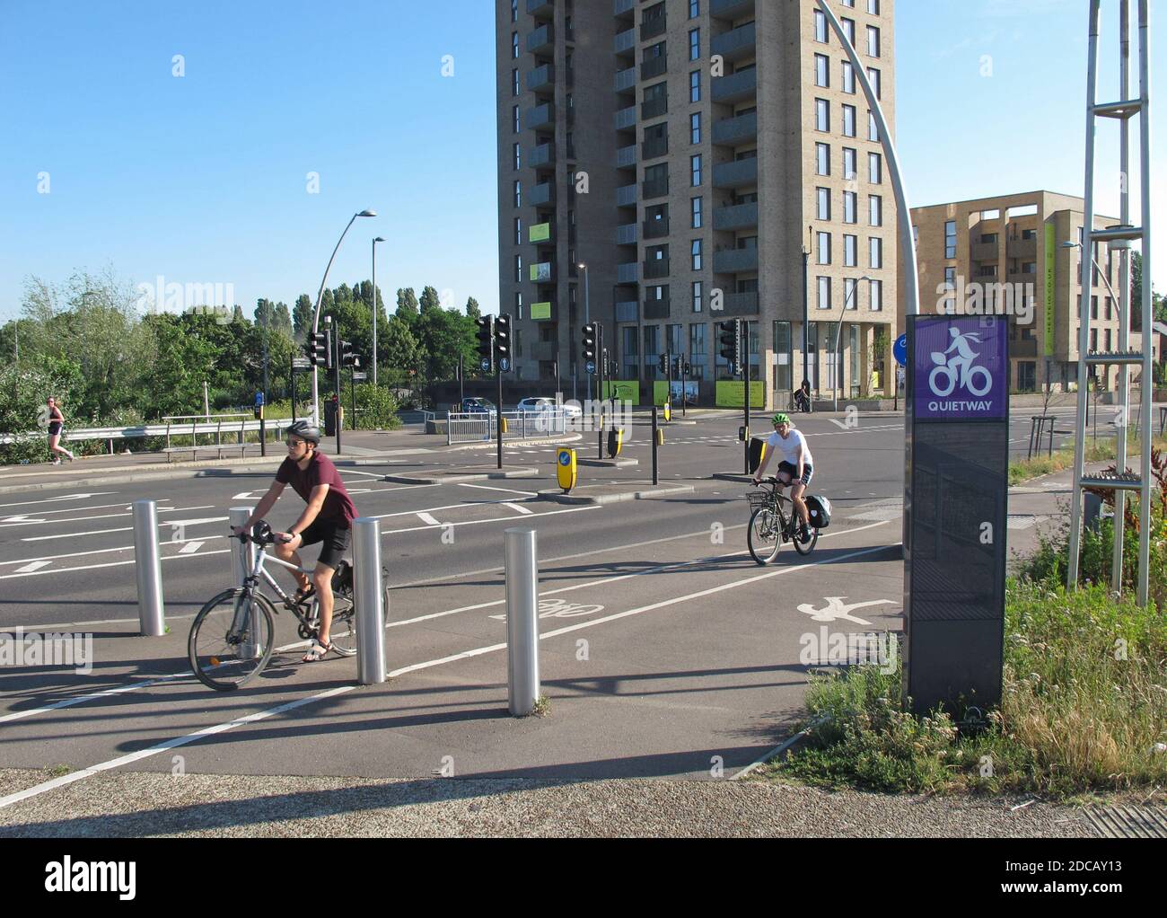 London, UK. Cyclists use the new segregated cycle lane along busy ...
