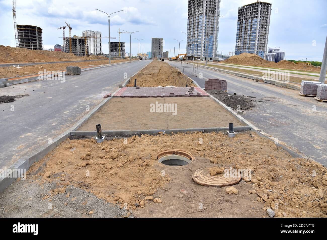 Laying paving slabs and borders at construction site. Process of ...