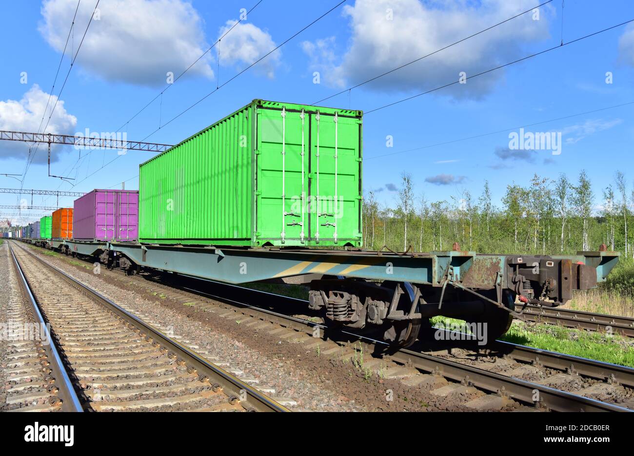 Cargo Containers Transportation On Freight Train By Railway. Intermodal Container On Train Car ...