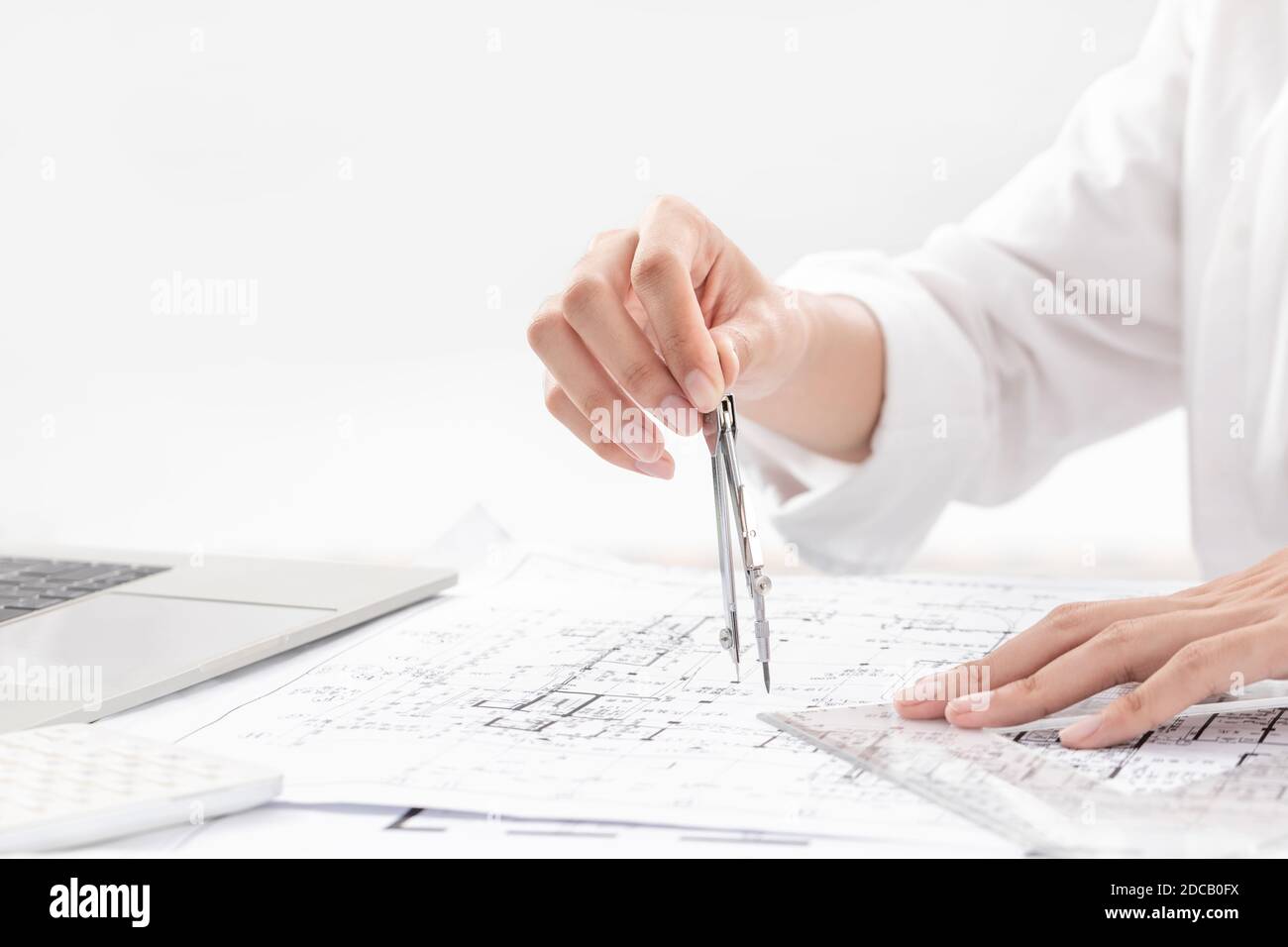 A hand of businesswoman writing on paper in the office Stock Photo - Alamy