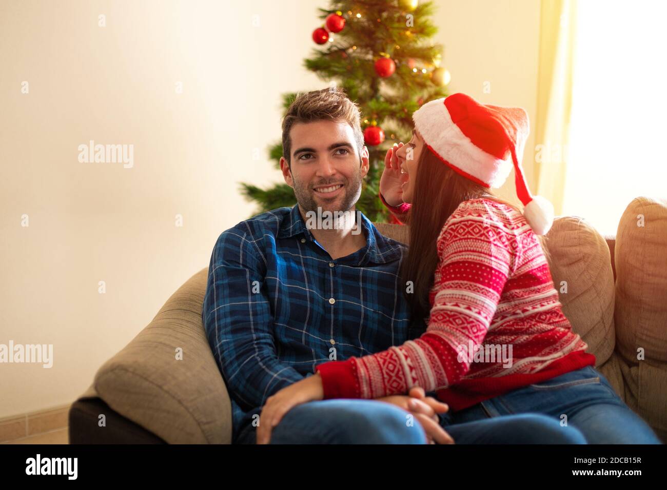 Young beautiful couple smiling happy and confident. Telling a secret to ...
