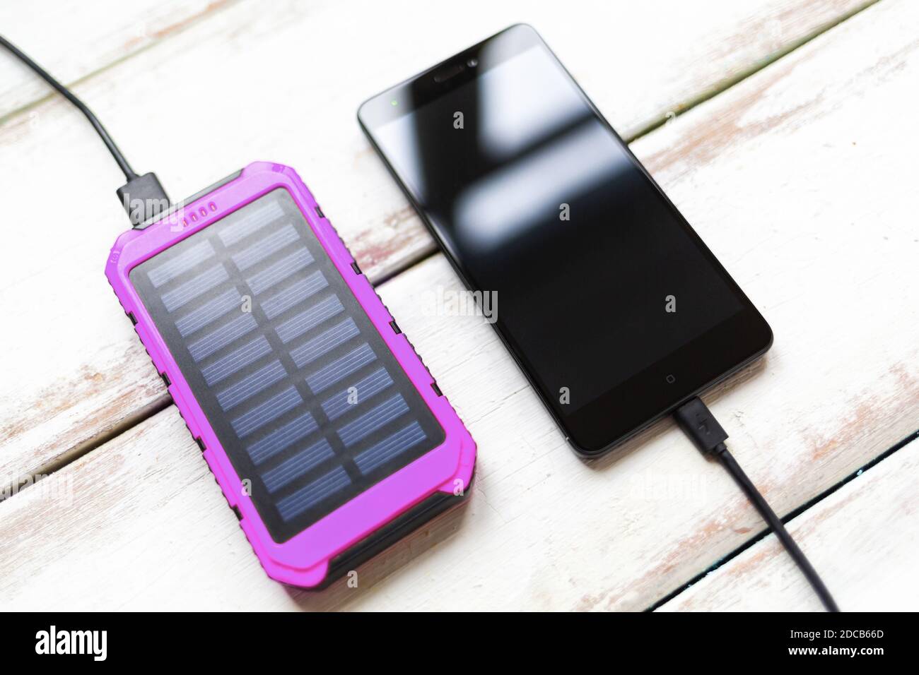 Concept of modern technologies. Smartphone with a black screen, charged ...